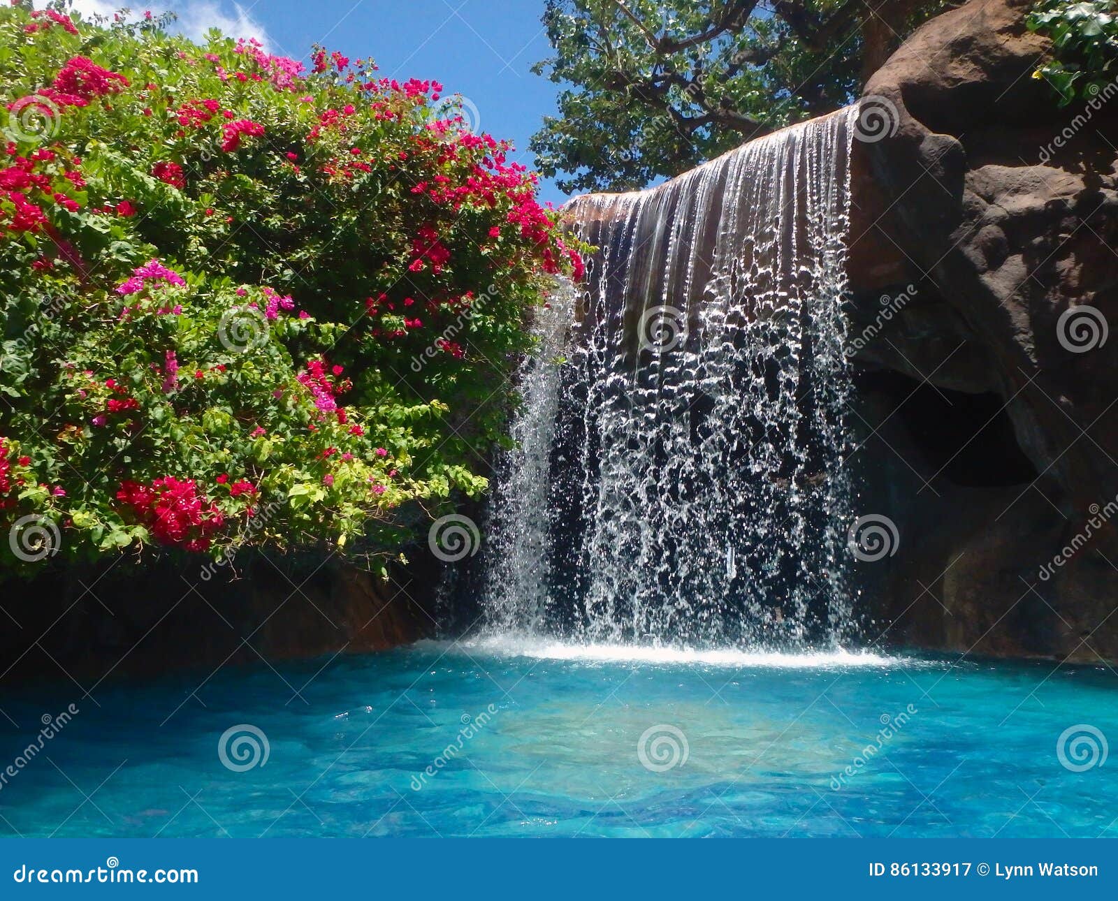 Resort pool and waterfall stock image. Image of colorful - 86133917
