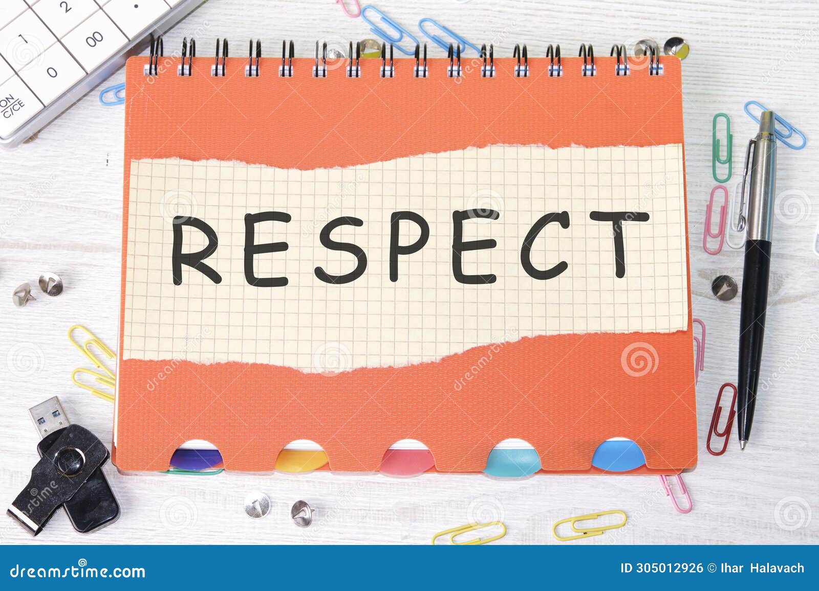 Respect Word is Written on a Sheet in a Cage Lying on a Notebook on the ...