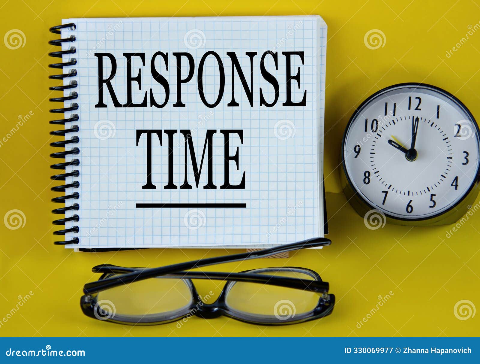 RESPONSE TIME - Words in a White Notebook with Alarm Clock and ...