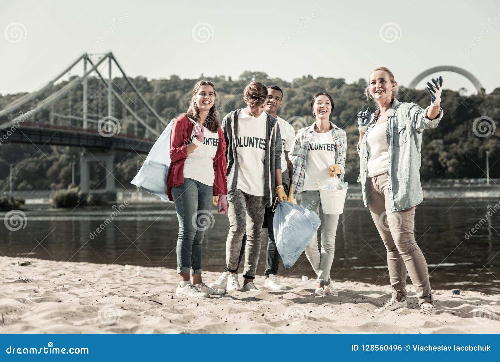 Responsible Teacher and Four Active Students Volunteering Near the ...