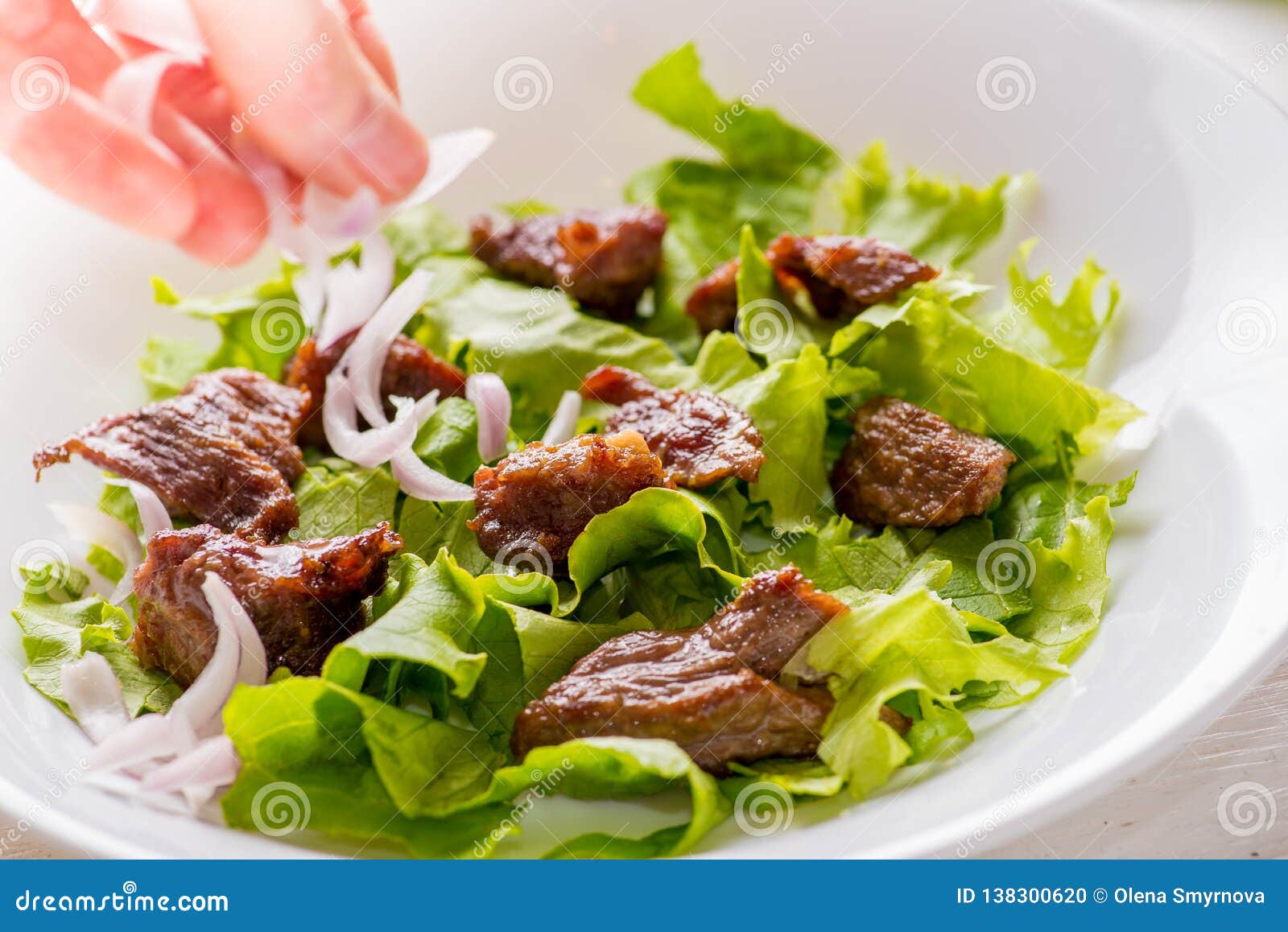 Ressing with Onion Ready Salad Stock Photo - Image of hands, dressing ...