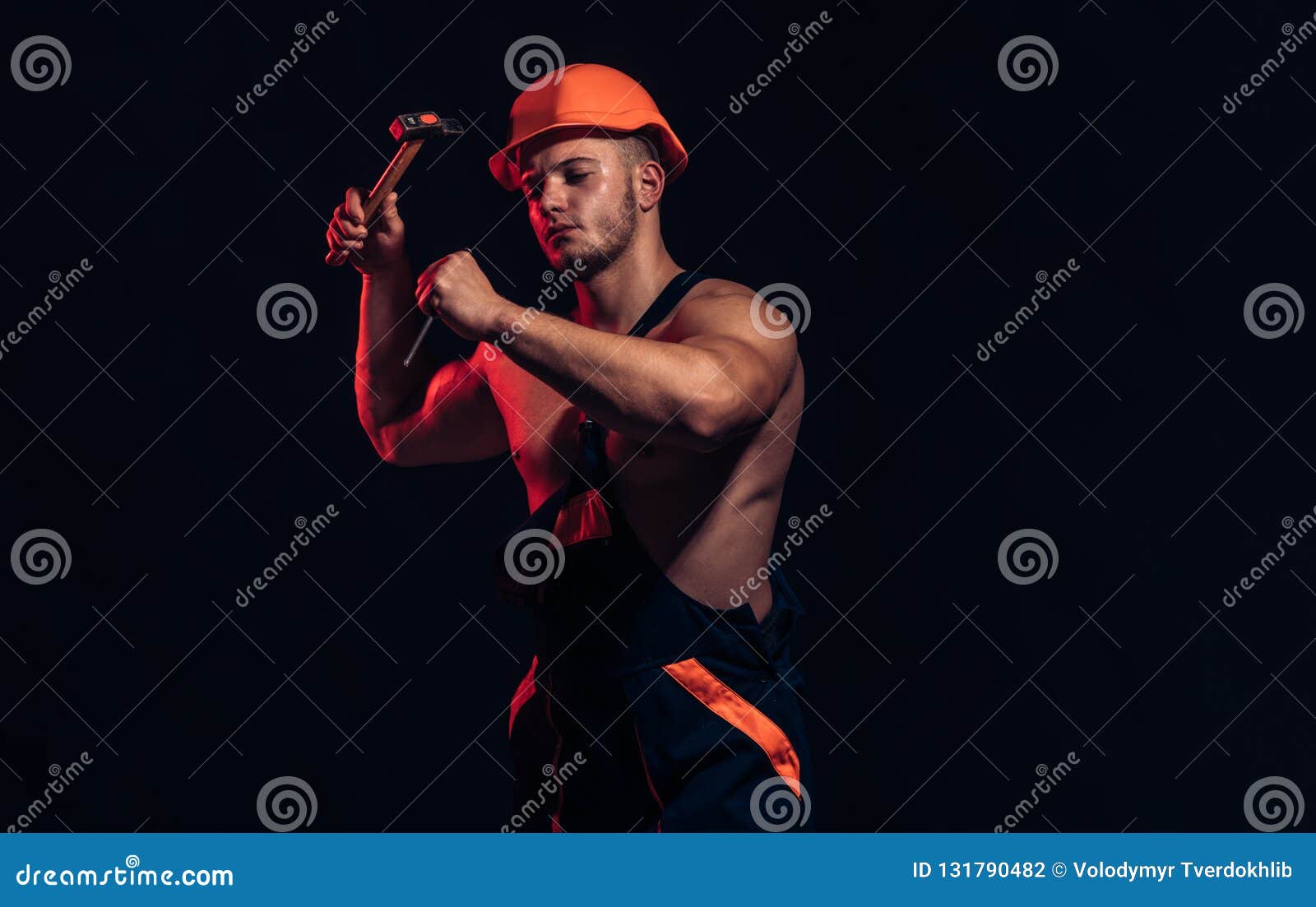 The Rest Being Still Under Construction. Muscular Man Builder at Work ...