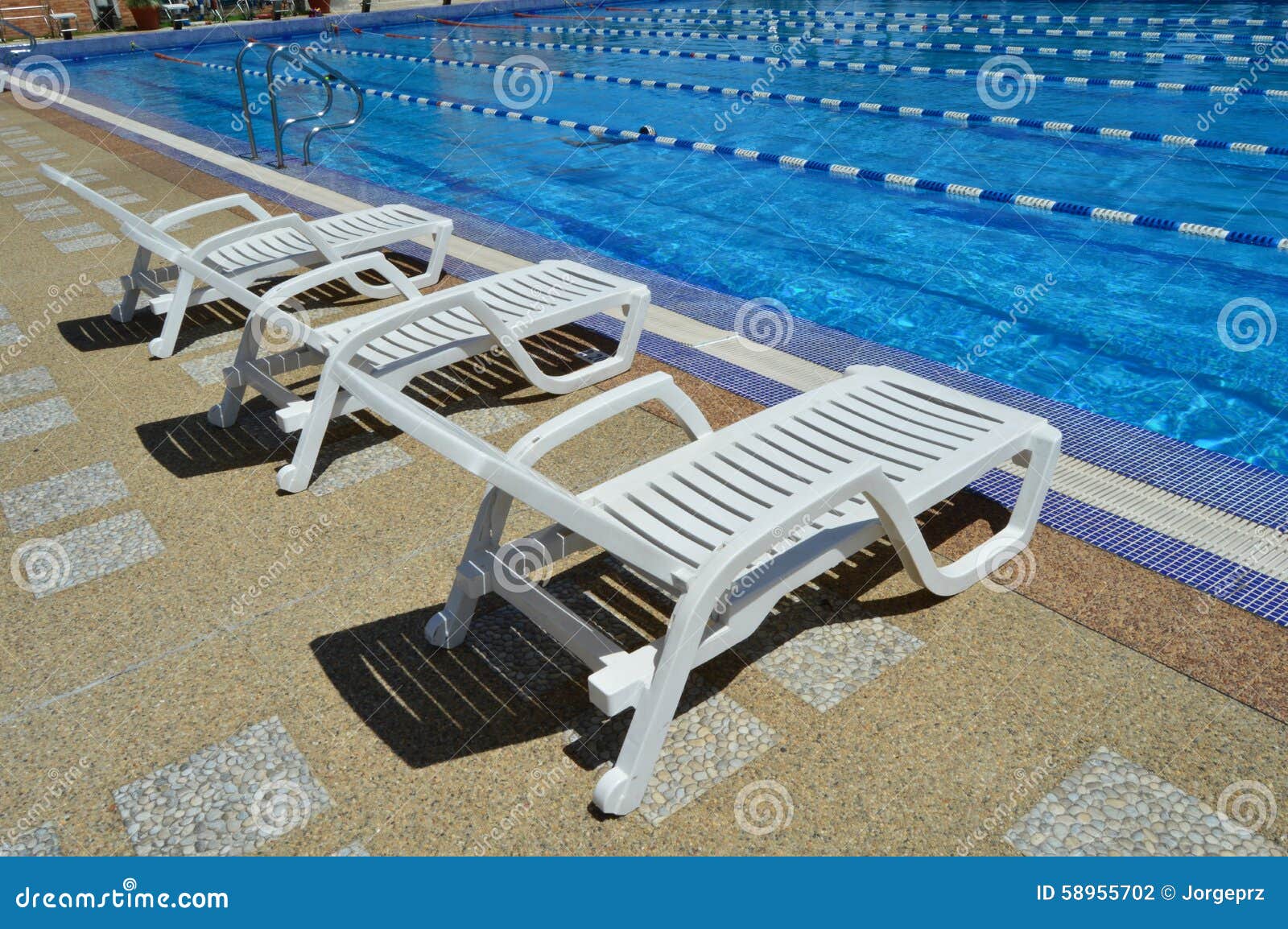 Rest chairs by the pool. stock photo. Image of blue, water - 58955702