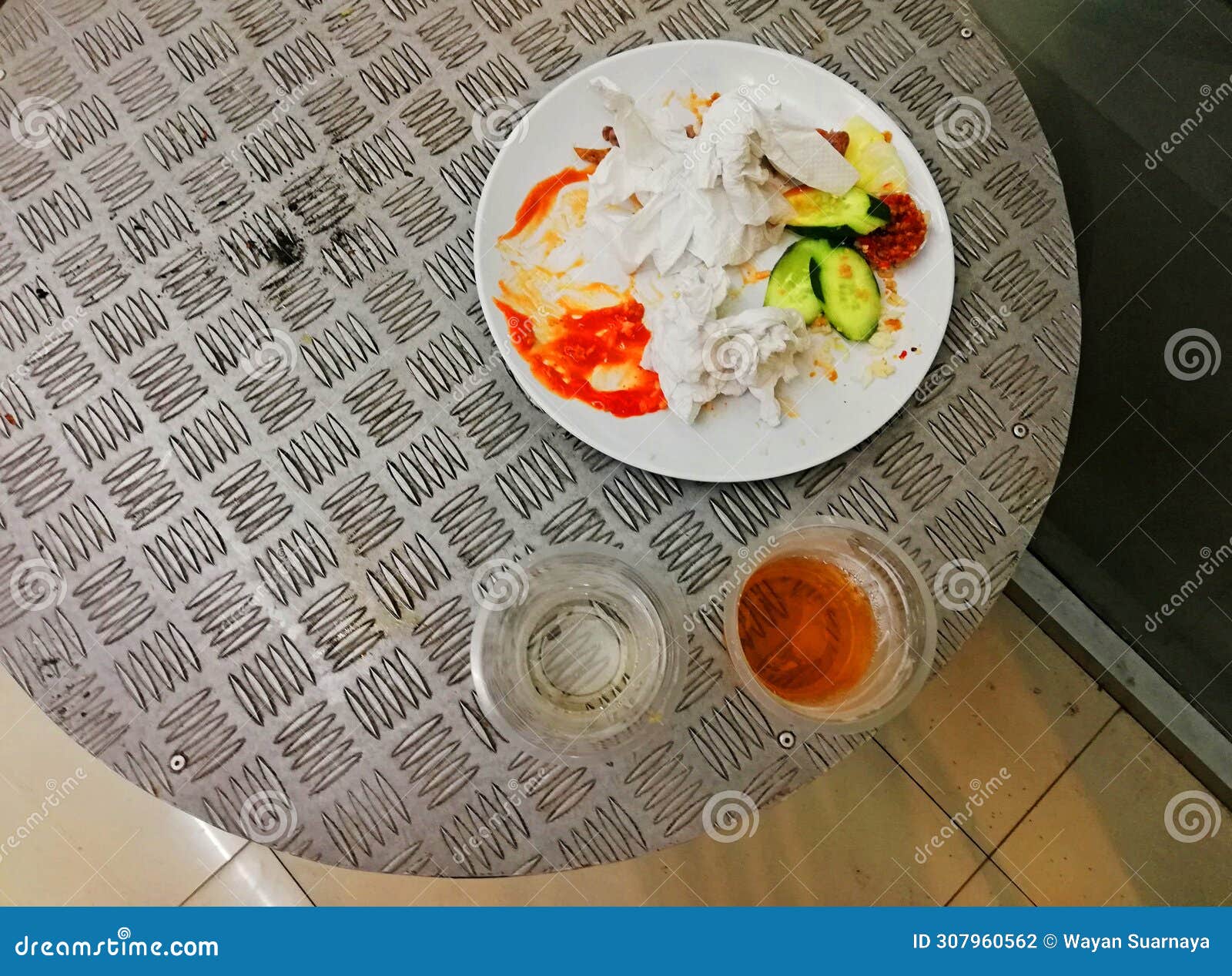 The Rest of Food Left on White Plate,on Metal Table Stock Photo - Image ...