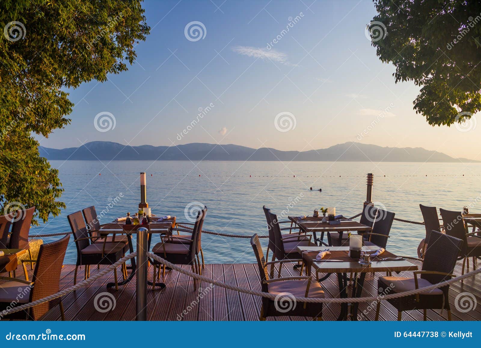 Restaurant on the beach stock photo. Image of hill, evening - 64447738