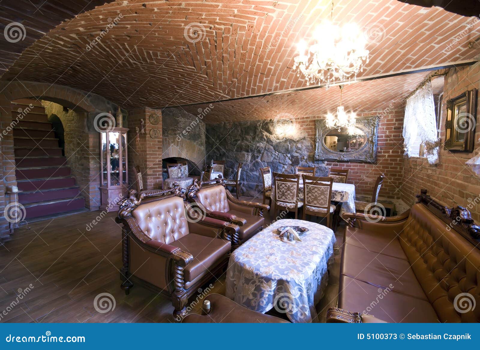 Restaurant in Brick Basement Stock Image - Image of chandeliers ...