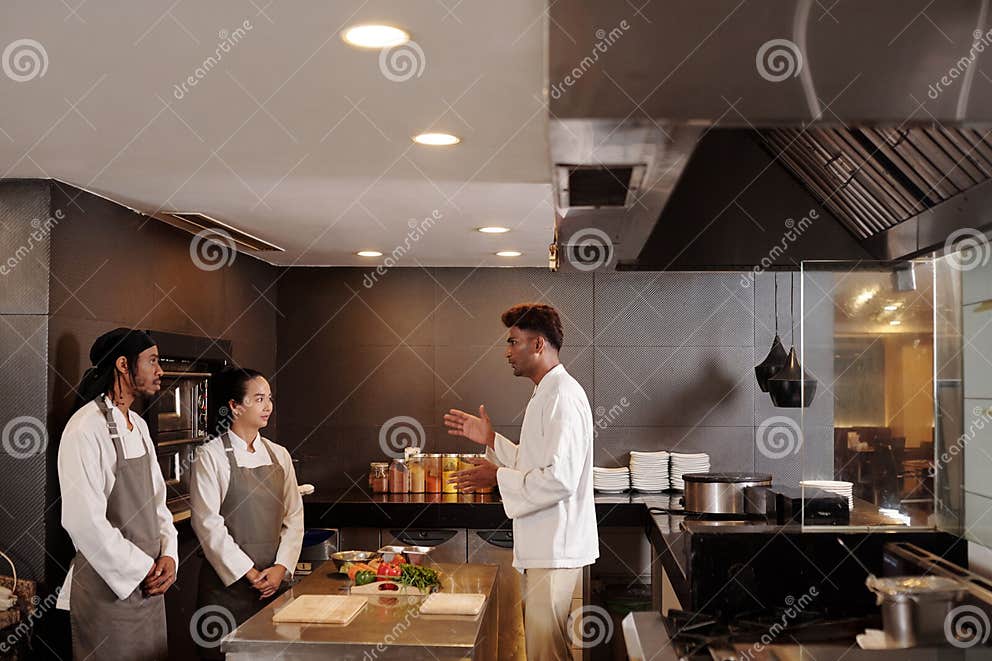 Restaurant Chef Explaining Processes Stock Photo - Image of cheerful ...