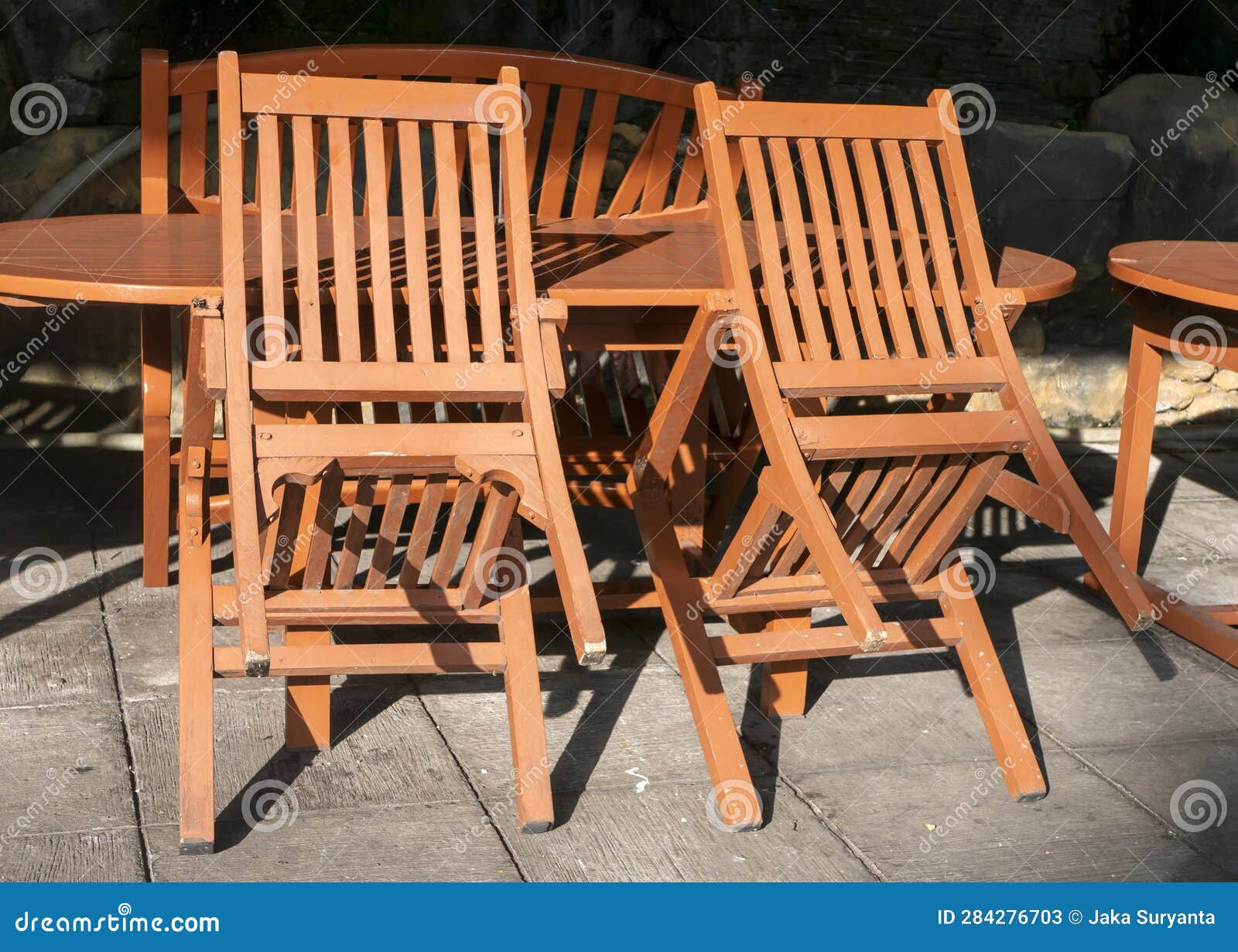 A Restaurant Closed with Wooden Chairs Leaning Against a Table Stock ...