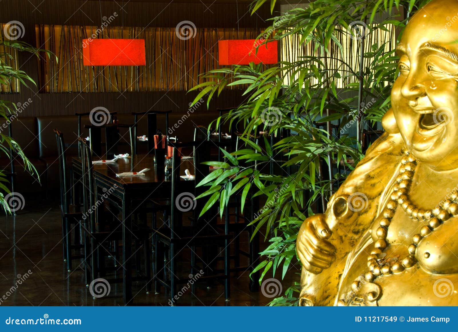 Restaurant Dining Room with a Golden Buddha Stock Image - Image of room ...
