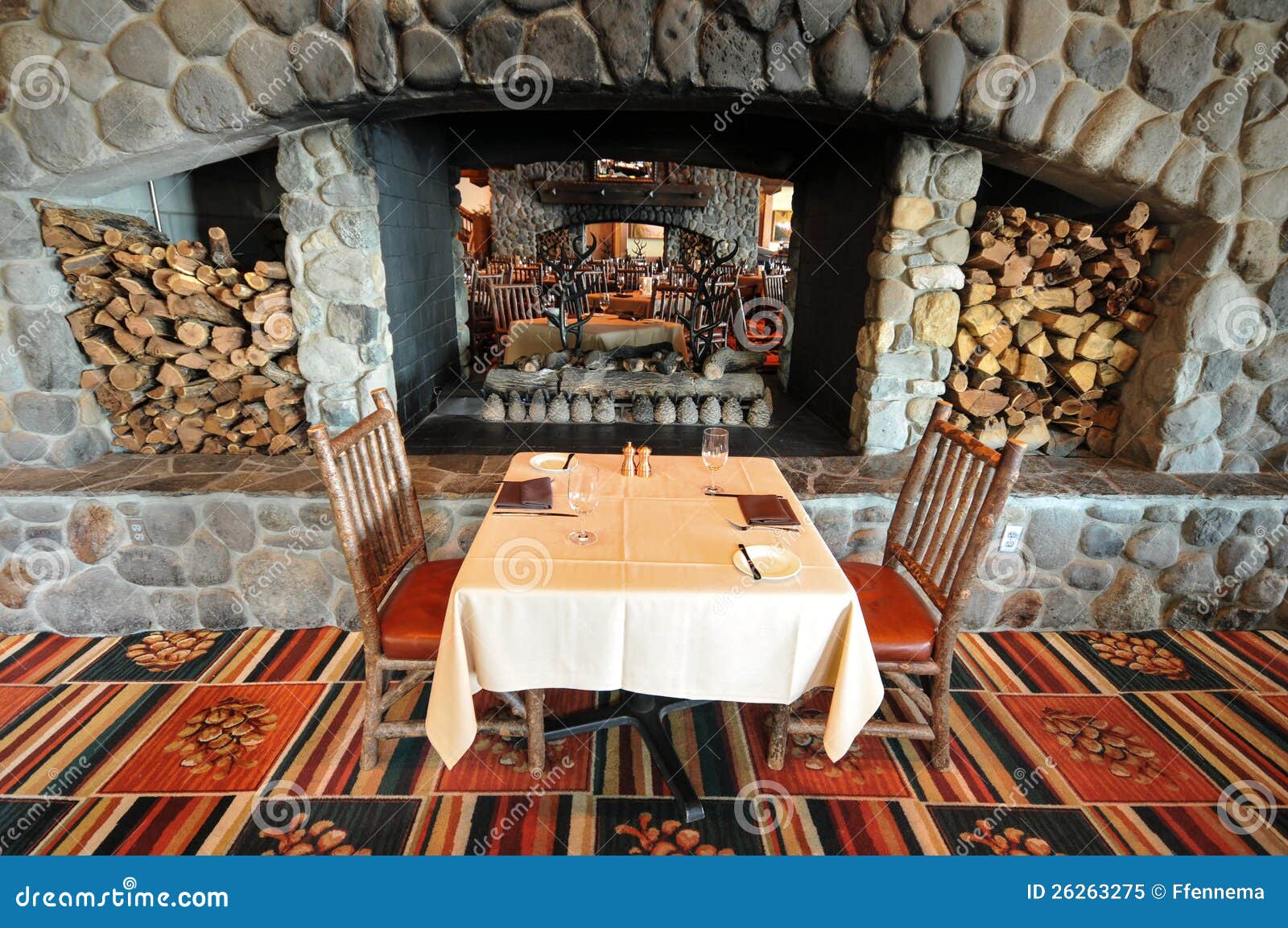 Restaurant Dining Table with Fireplace and Logs Stock Image - Image of ...