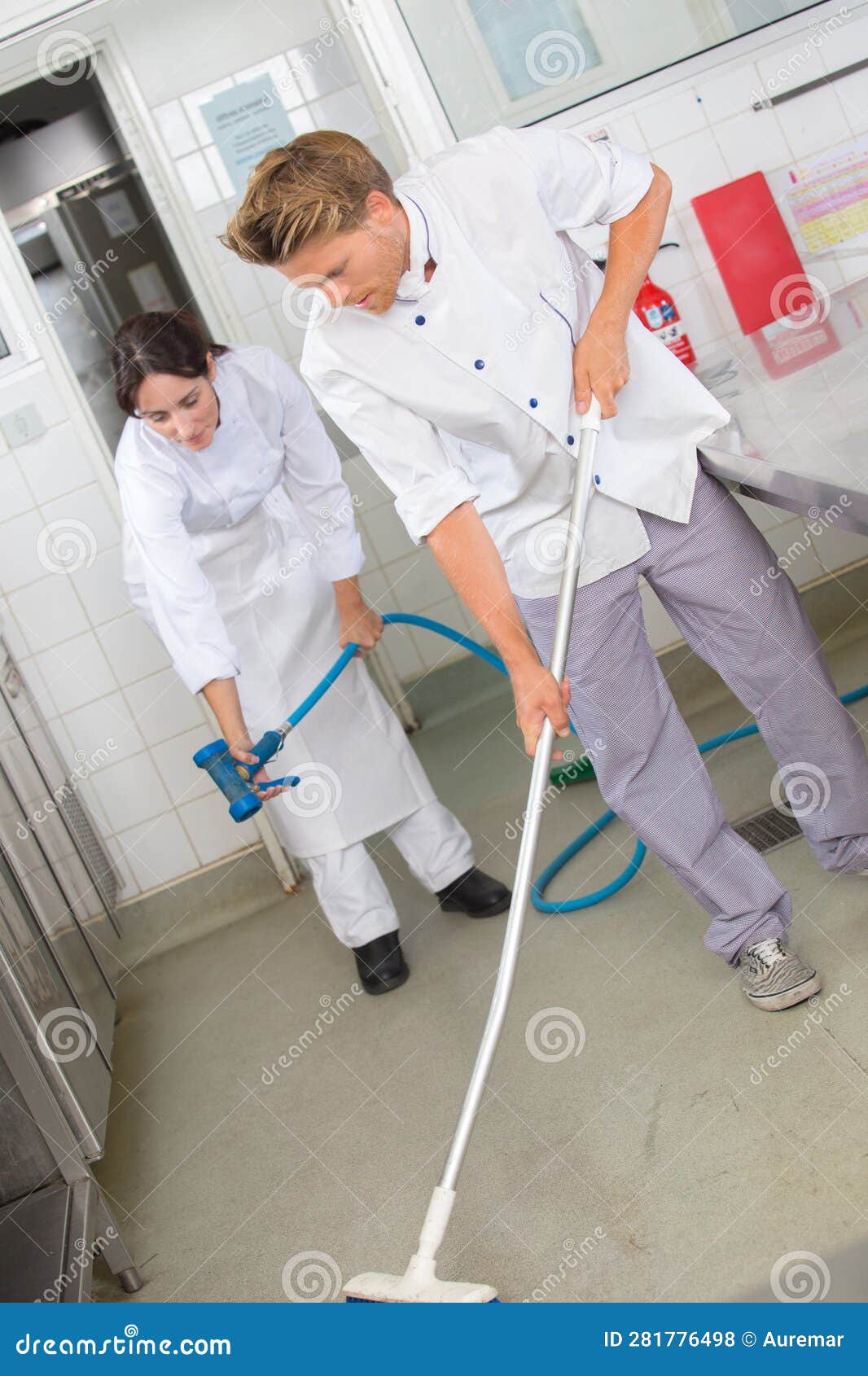 Restaurant Employees Cleaning Kitchen Floor Stock Photo - Image of ...