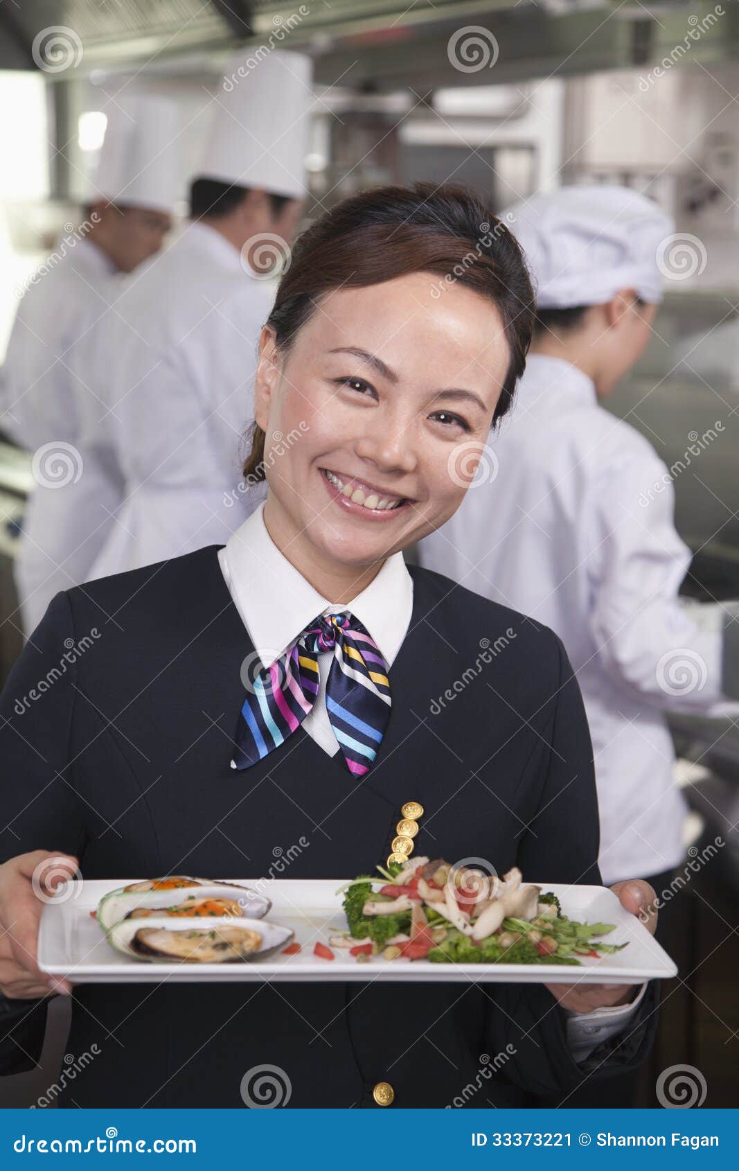 Restaurant Hostess Presenting Gourmet Dish Stock Image - Image of 5559 ...