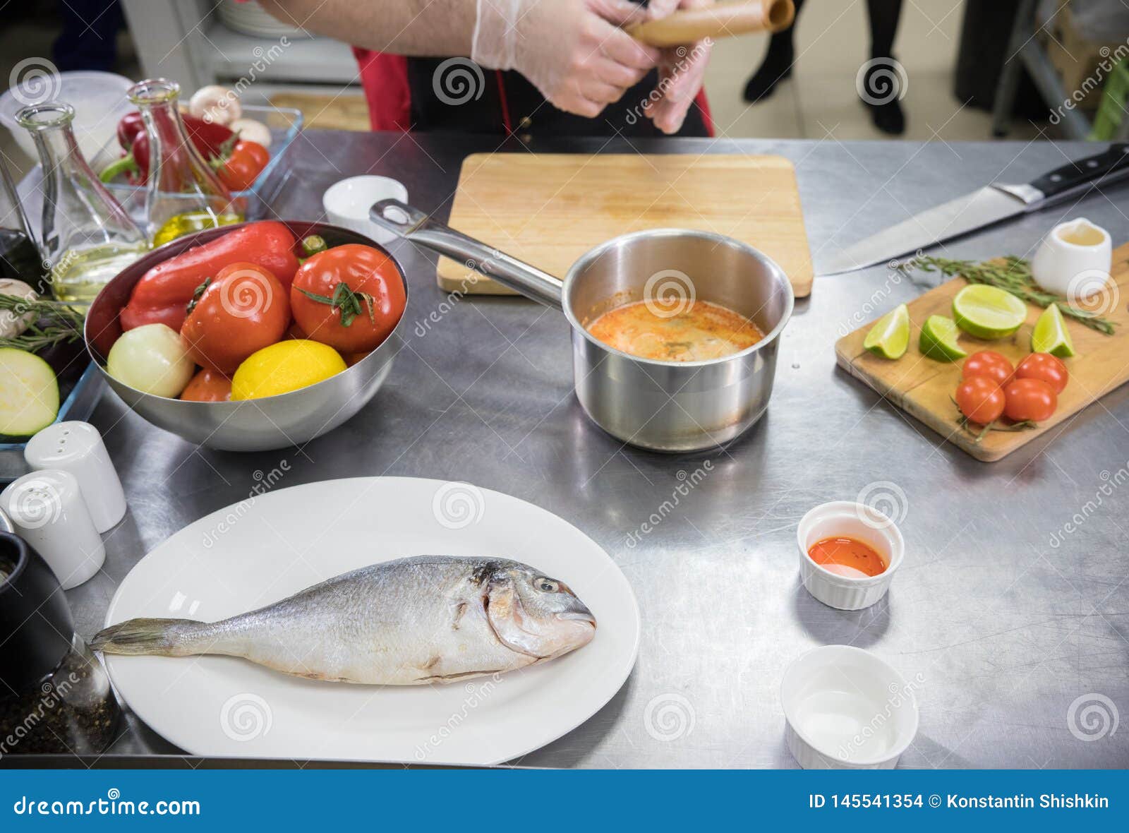 Restaurant Kitchen. Chef Making a Soup with Seafood Ingredients Stock ...