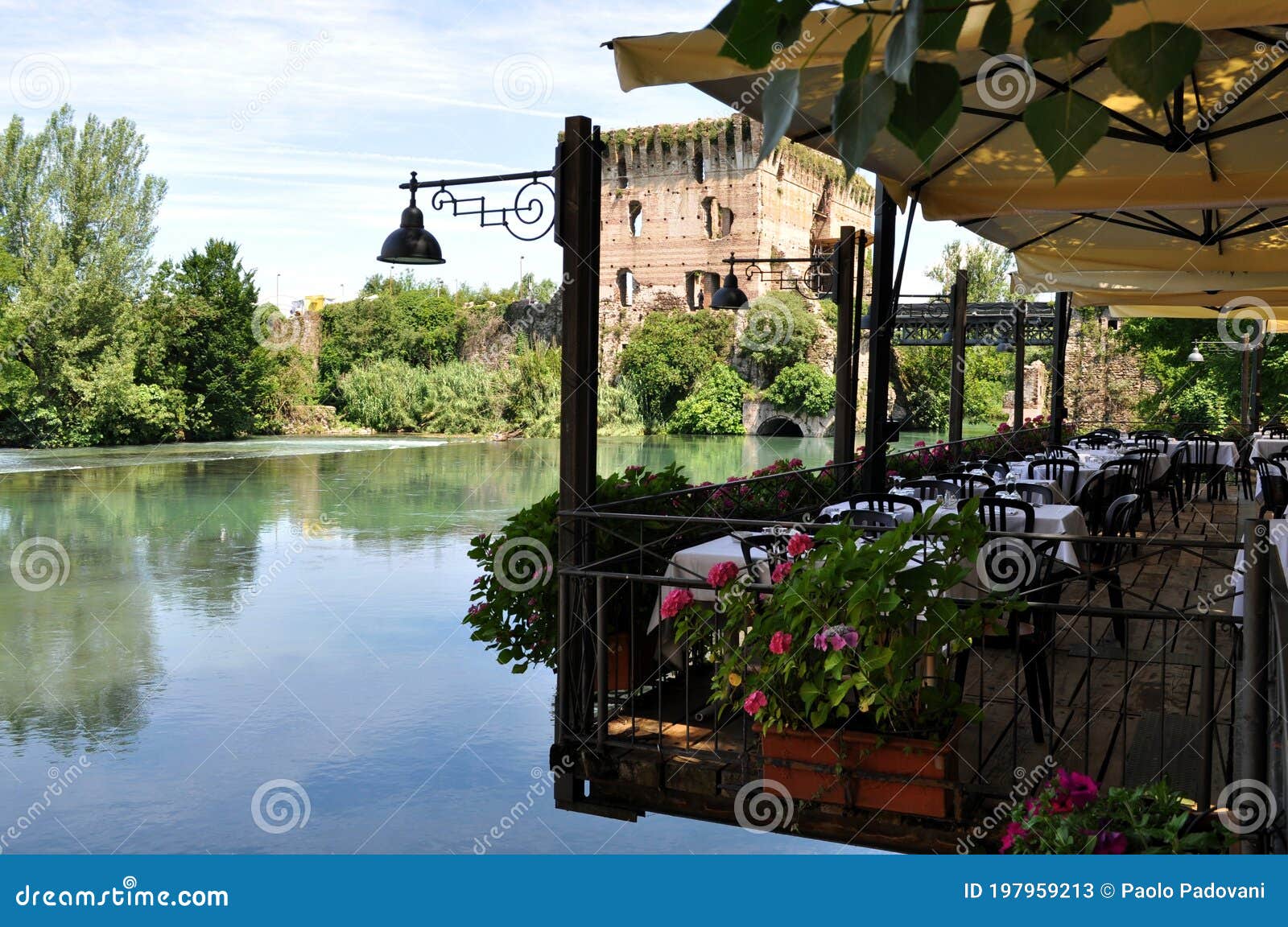 Restaurant on the lake stock image. Image of borghetto - 197959213