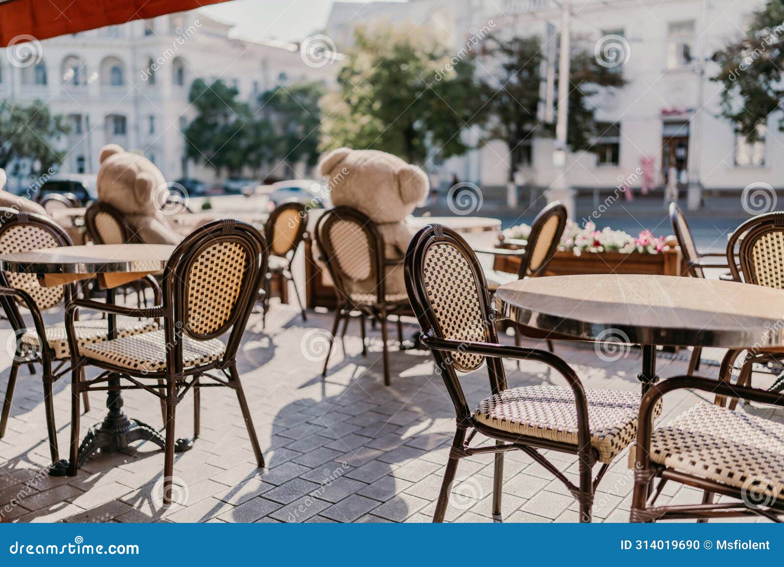 A Restaurant with a Lot of Chairs and Tables. There are Two Teddy Bears ...
