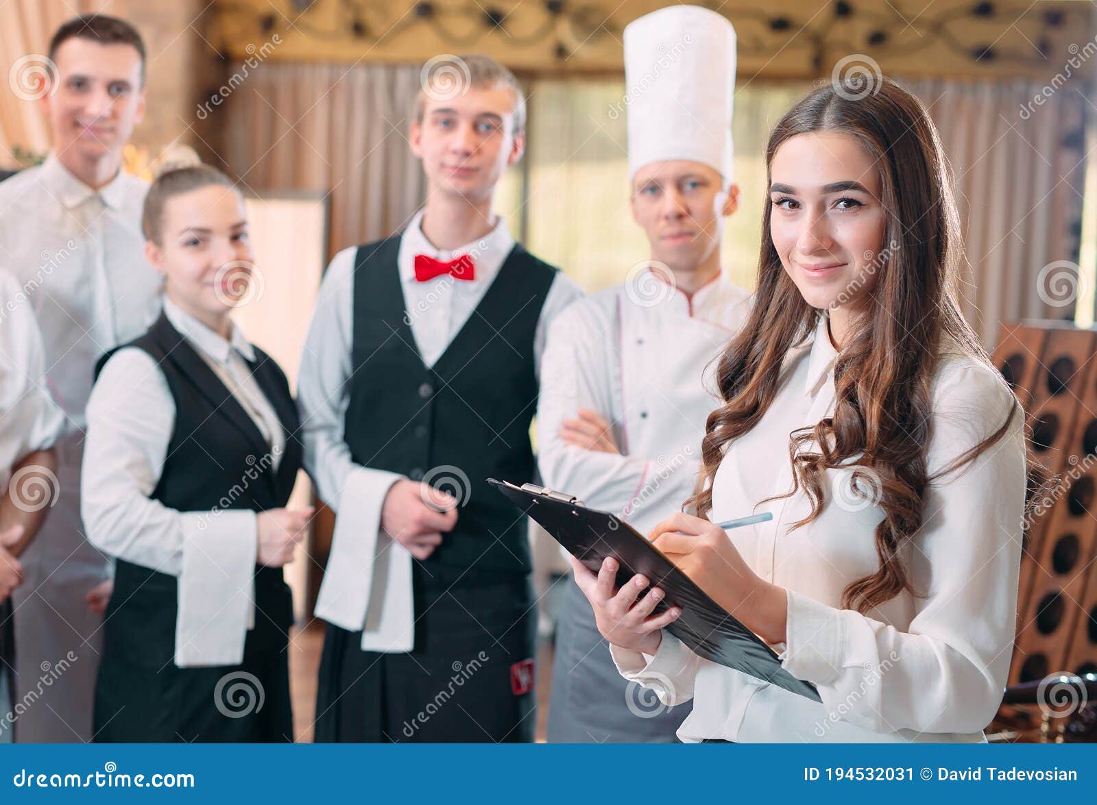 Restaurant Manager and His Staff in Kitchen. Interacting To Head Chef ...