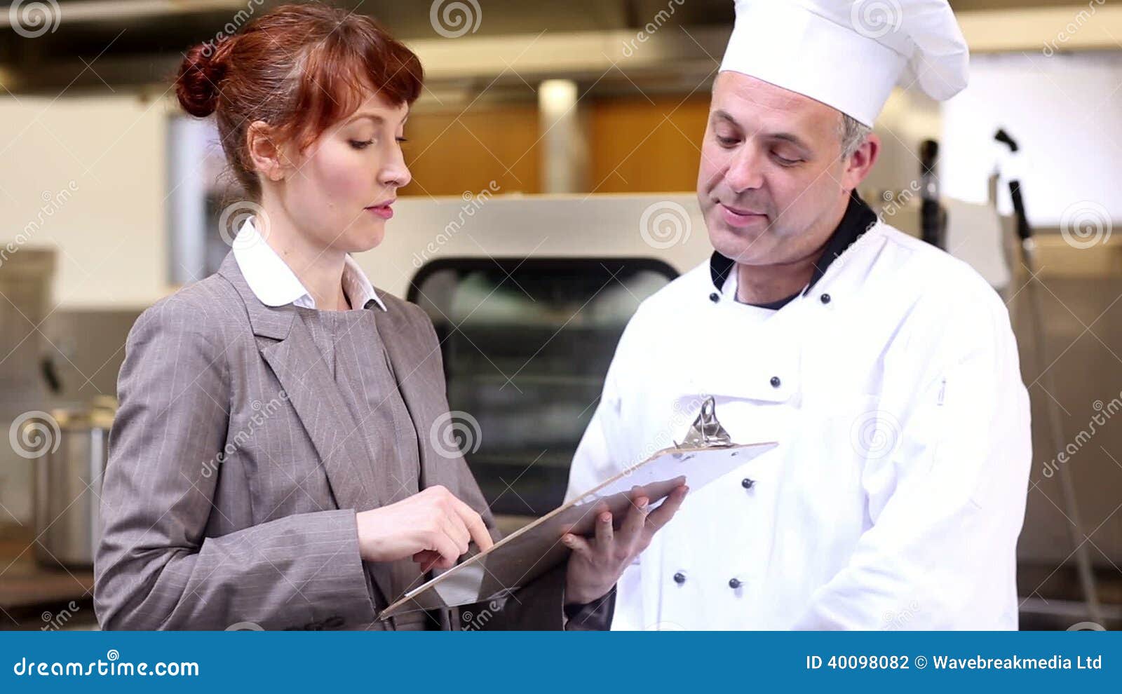 Restaurant Manager Speaking with Head Chef Stock Footage - Video of ...