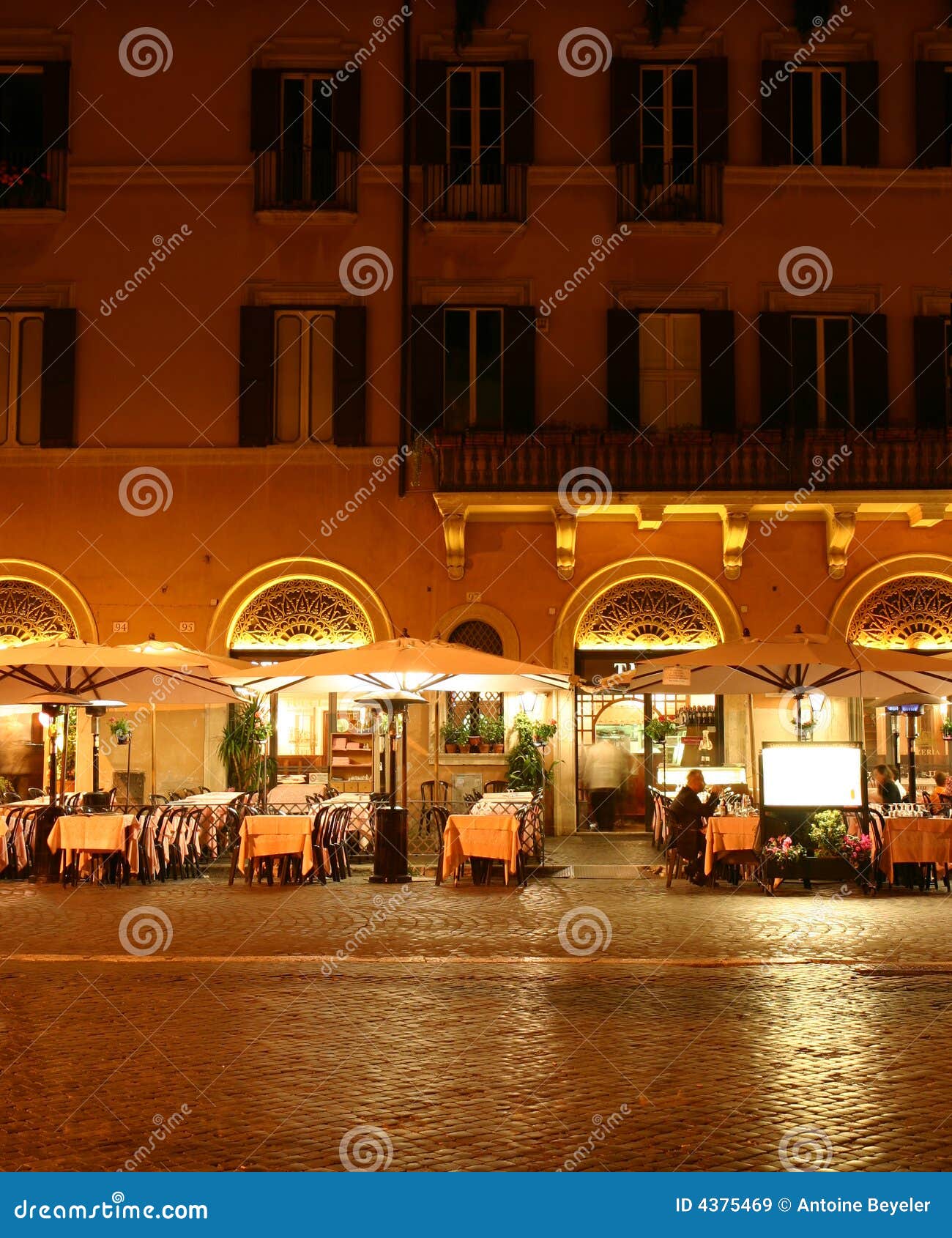 Restaurant at night stock image. Image of table, paved - 4375469