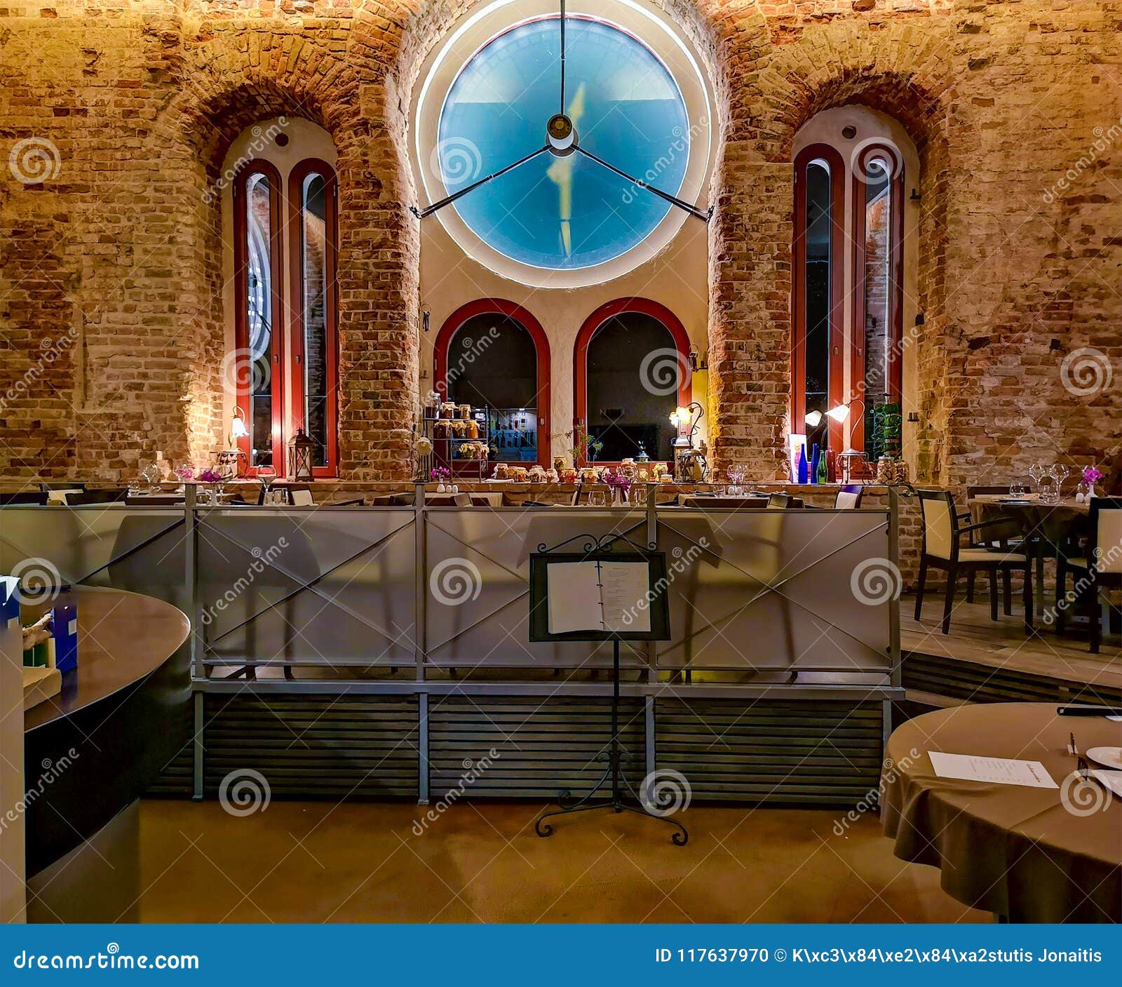 Restaurant in Old Tower with Clock Stock Photo - Image of menu, tables ...