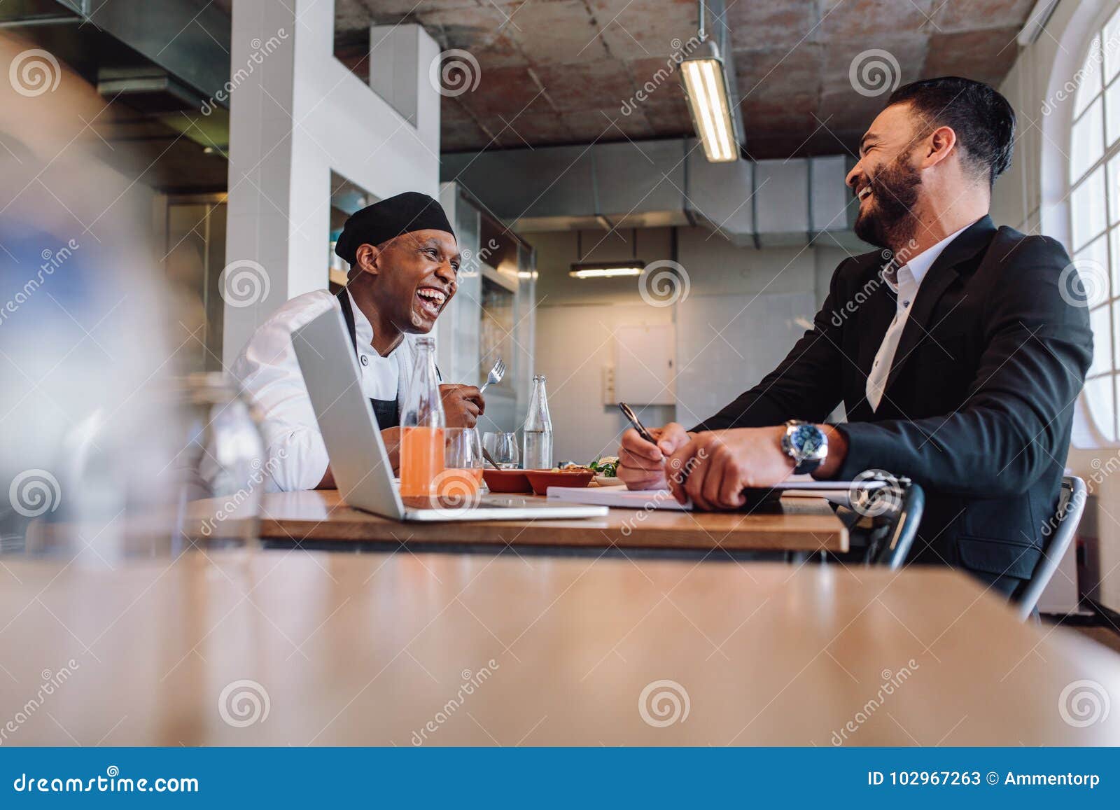 Restaurant Owner Having a Friendly Conversation with Employee Stock ...
