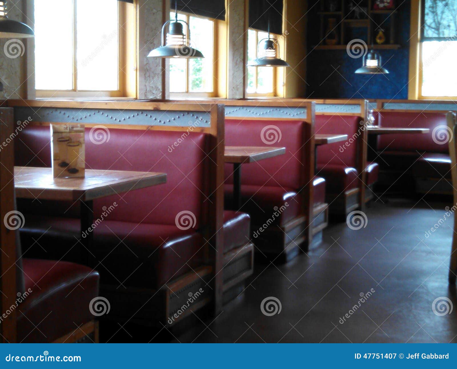A Diner Car With Red Booths And Black And White Checkered Floor. AI ...