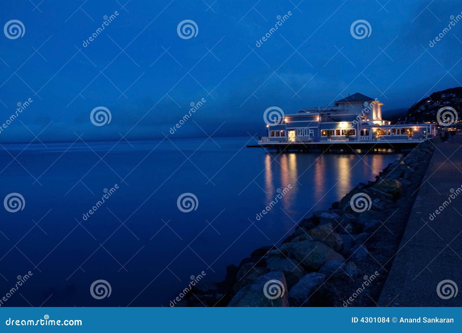 A Restaurant by the Sea at Sunset Stock Photo - Image of calm, water ...