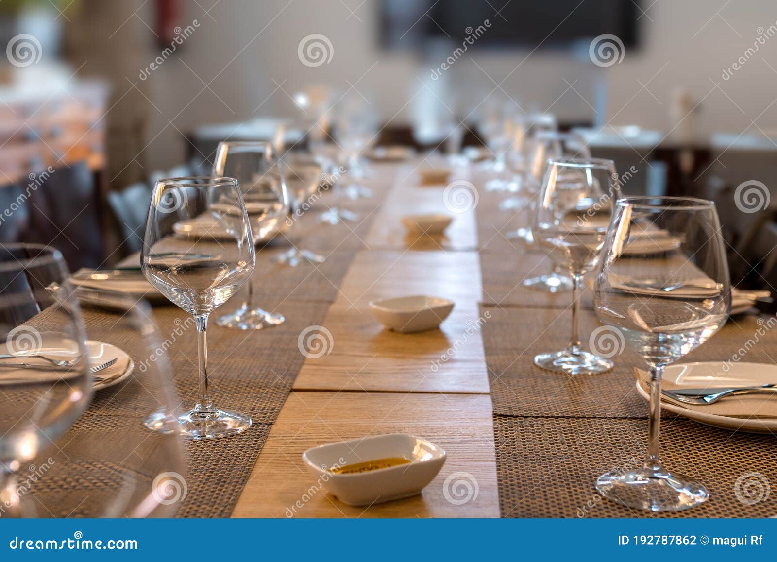 Restaurant Table for Multiple Diners with Glasses and Cutlery and Olive ...