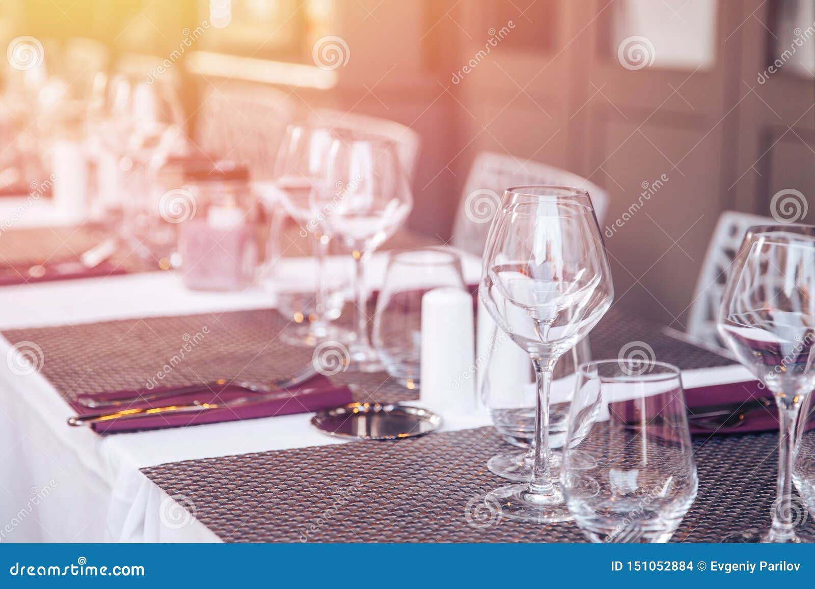 Restaurant Table Setting, Wine Glasses and White Plates. Glare of Light ... Restaurant Table Setting, Wine Glasses and White Plates. Glare of Light ...