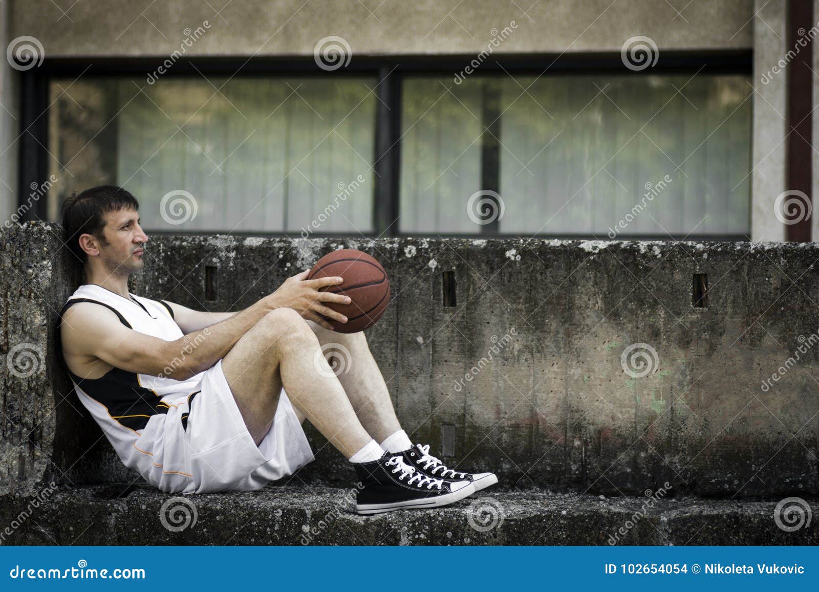 Resting basketball player stock photo. Image of ball - 102654054