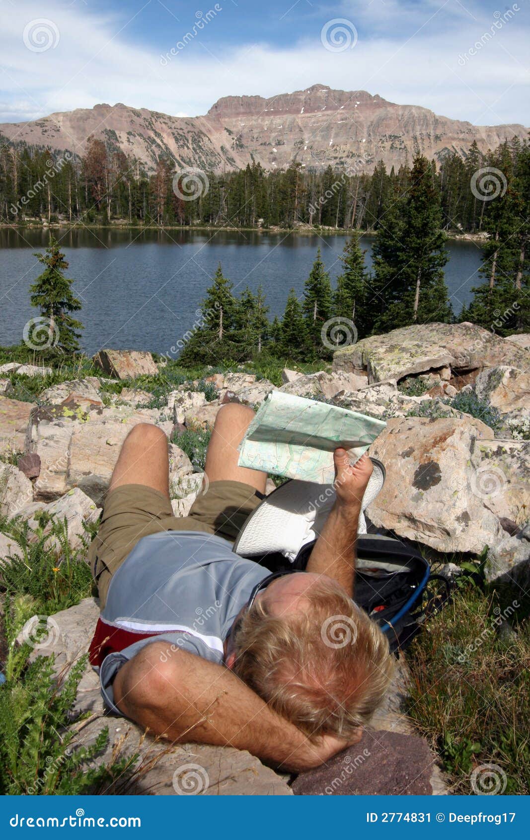 Resting hiker with map stock image. Image of mountain - 2774831
