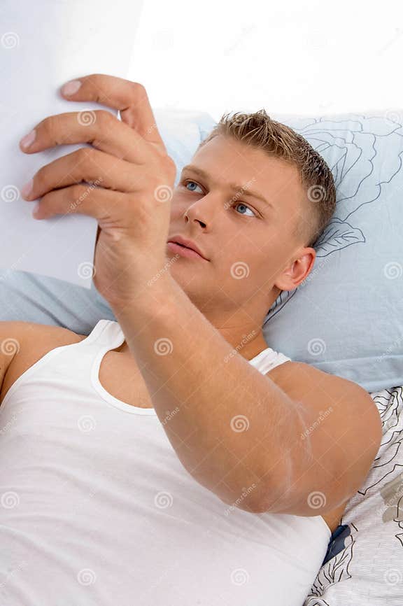 Resting man reading report stock image. Image of official - 7420487