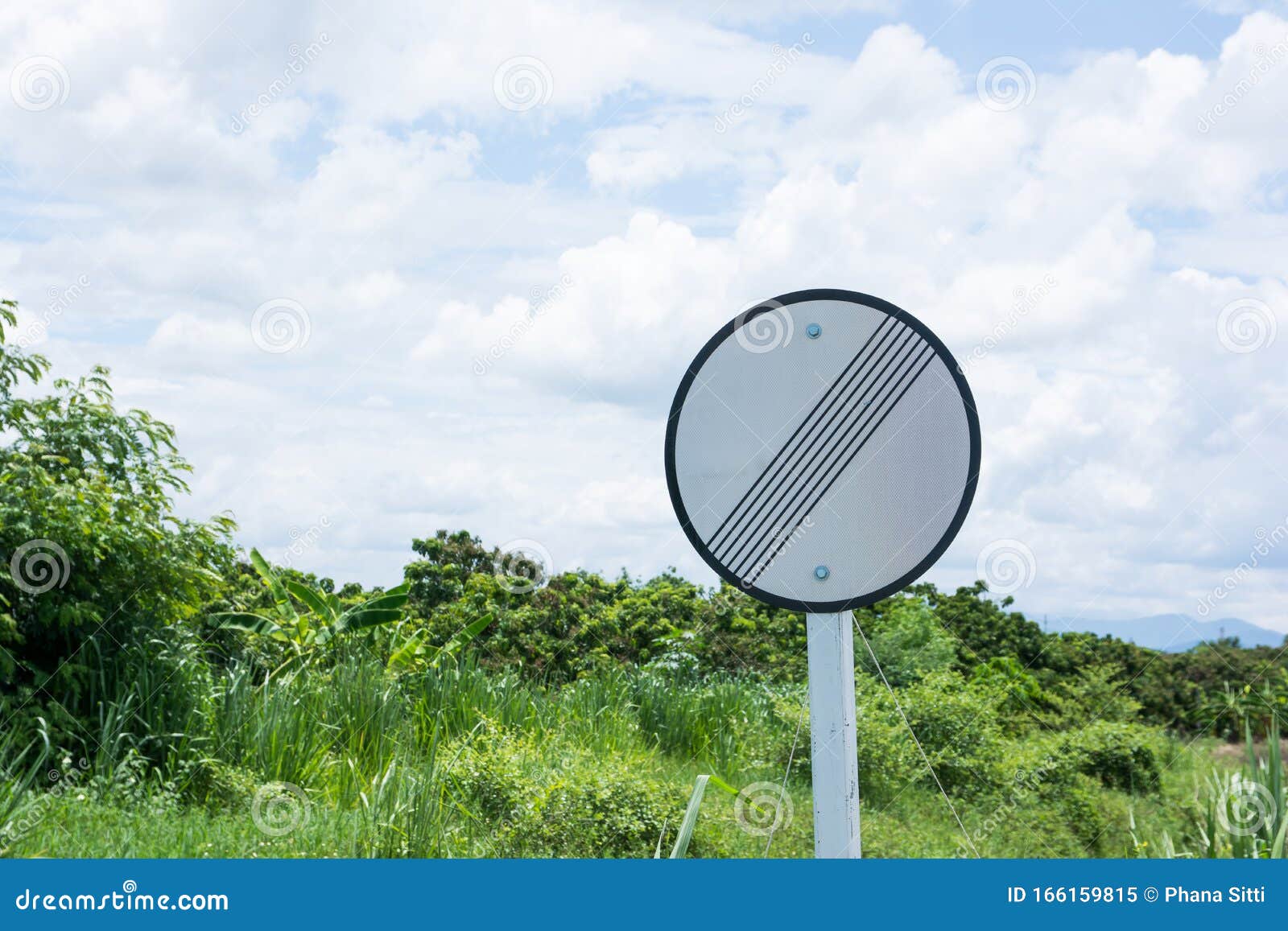 Restriction Ends Sign beside the Road with Tree and Sky Background ...
