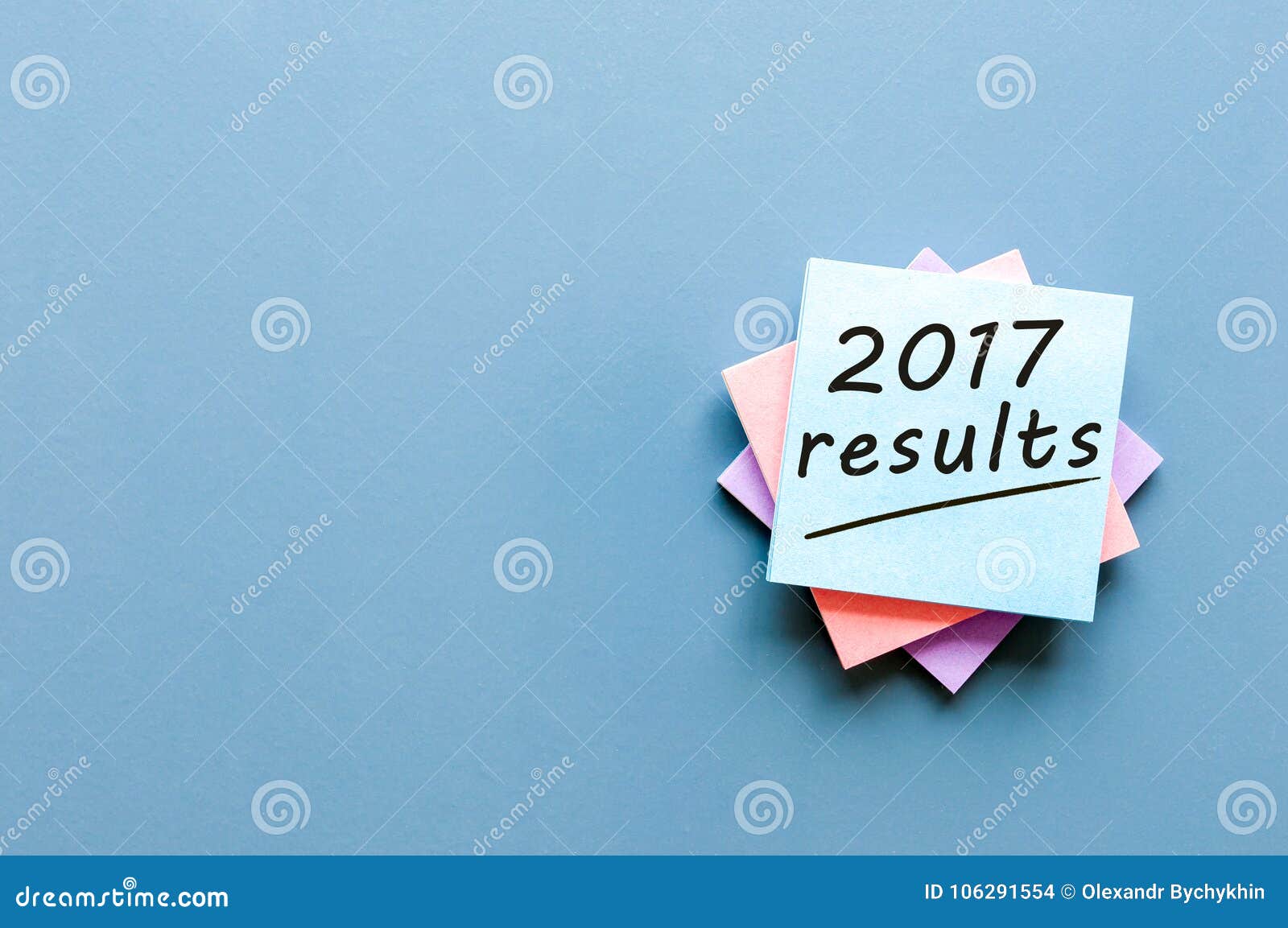 2017 Results Text on a on a Pile of Papers for Notes at Blue Background ...