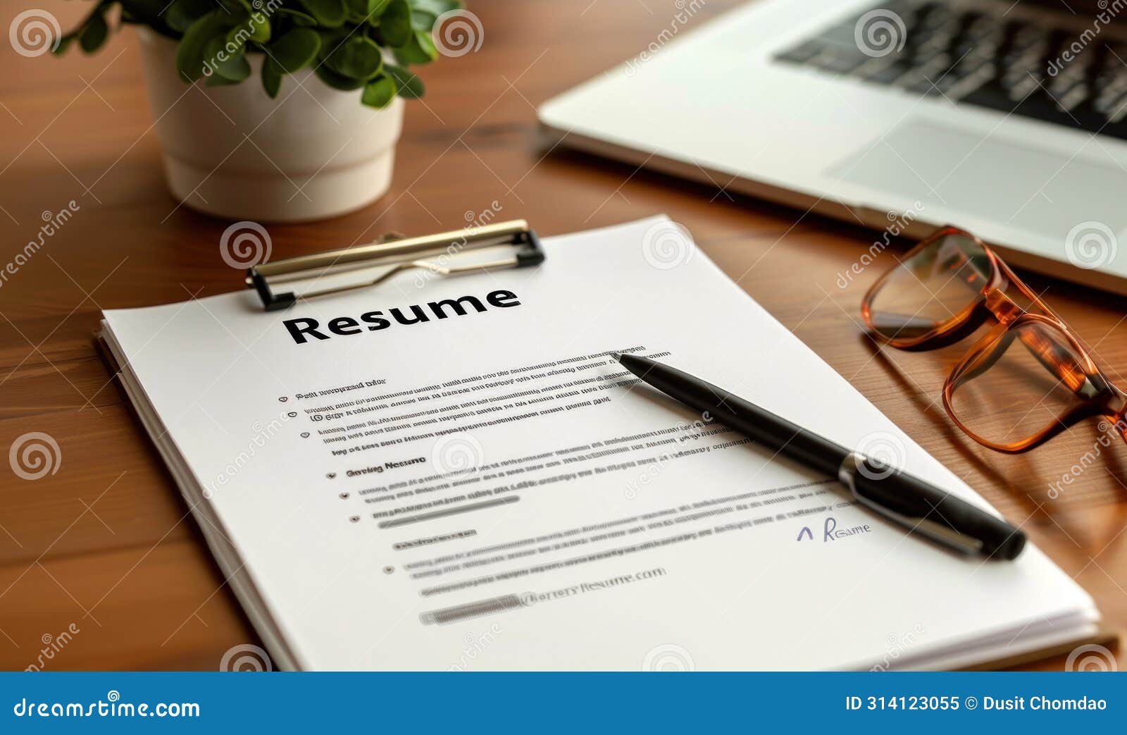 A Resume is on a Table with a Pen and a Laptop Stock Image - Image of ...