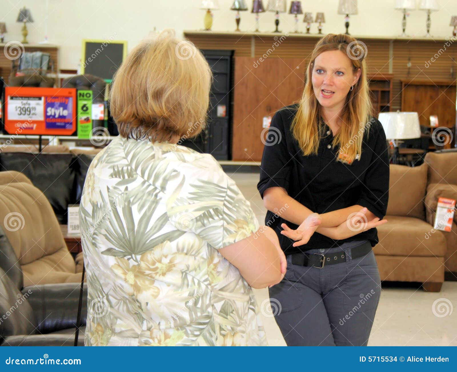 Retail Associate Helping Customer Stock Photo - Image of blond ...