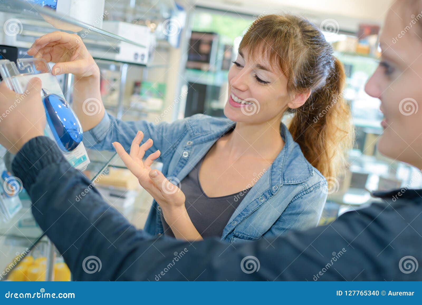 Retailer Showing Computer Mouse To Customer Stock Photo - Image of ...