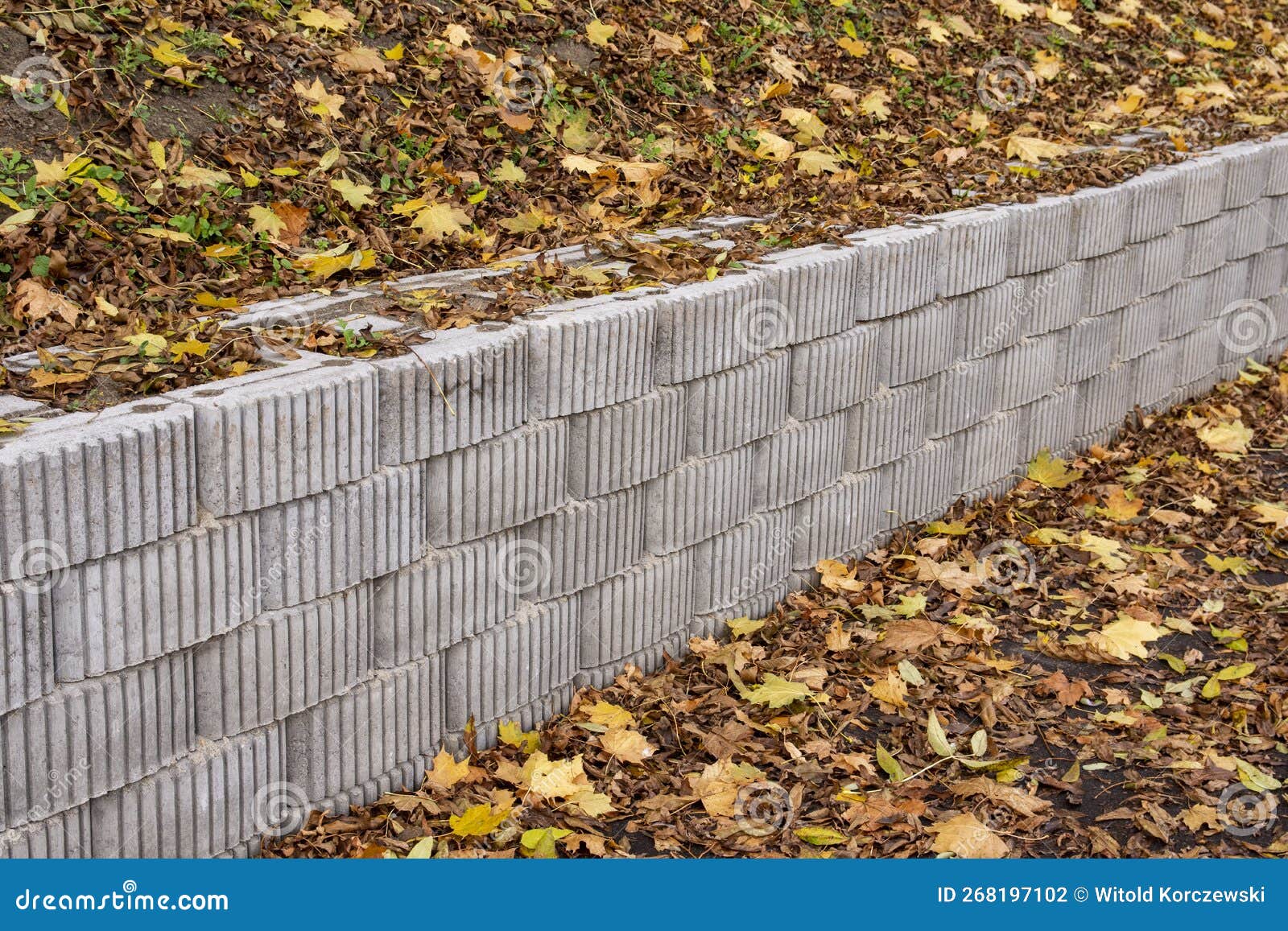 A Retaining Wall Made of Concrete Elements Protects the Roadway and ...
