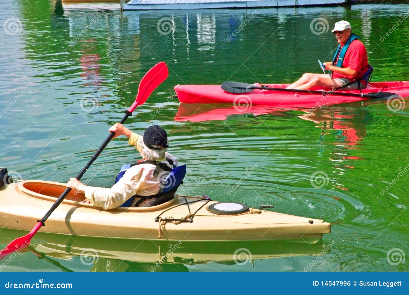 Retired Couple on Kayaks stock photo. Image of kayak - 14547996