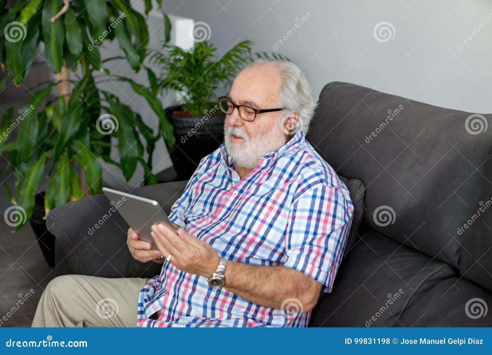 Retired man in his home stock photo. Image of looking - 99831198