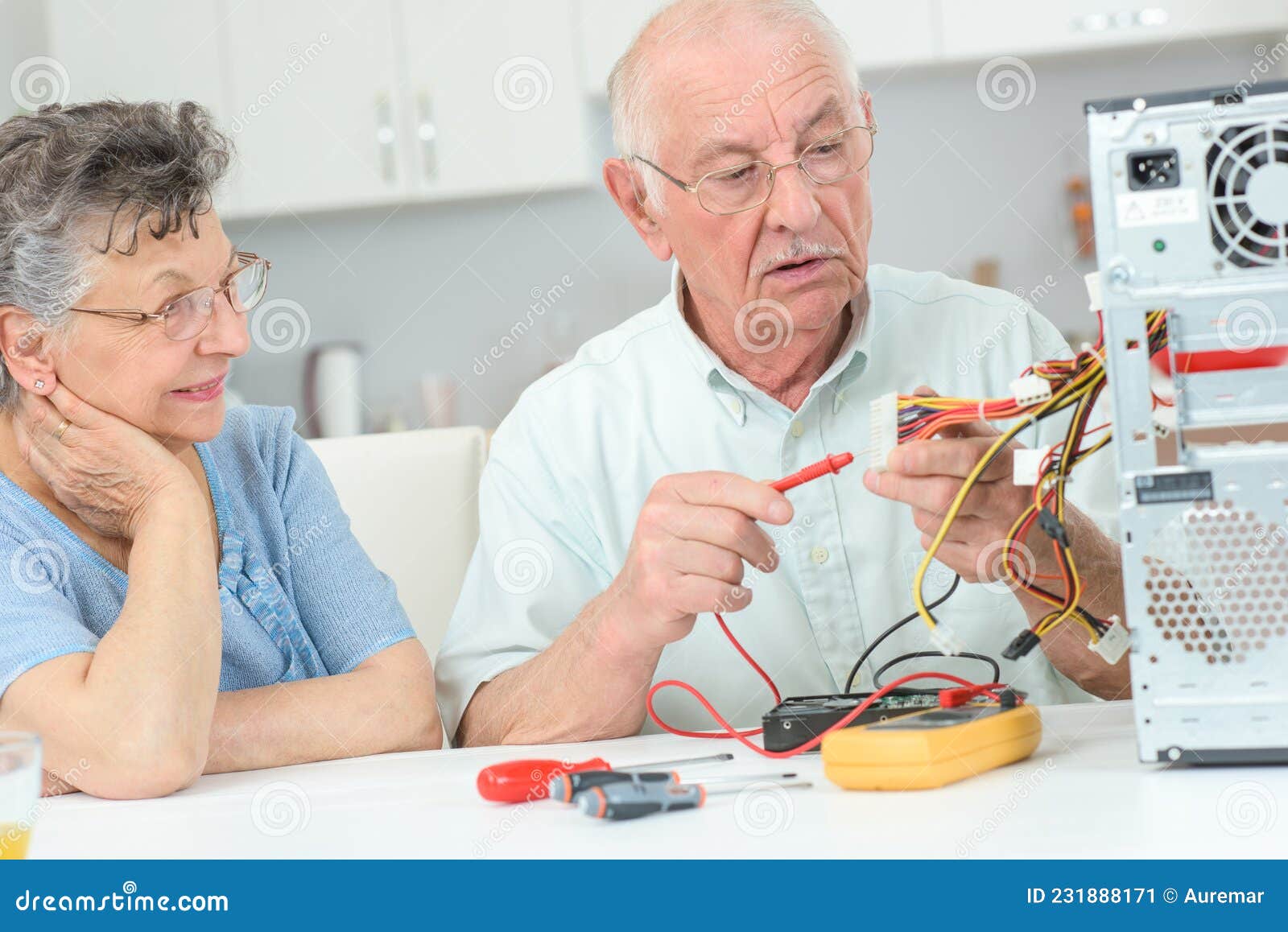 Retired Man Testing Computer with Multimeter Stock Image - Image of ...