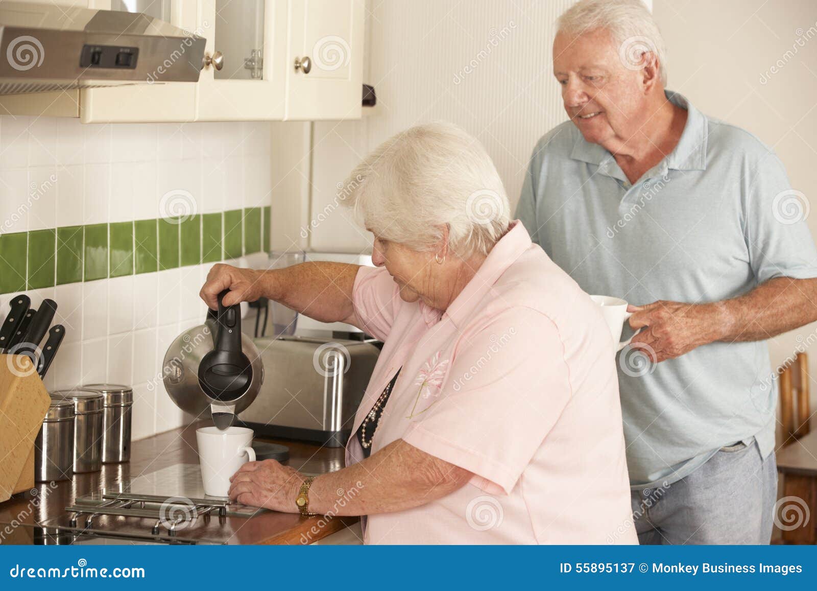 Retired Senior Couple in Kitchen Making Hot Drink Together Stock Image ...