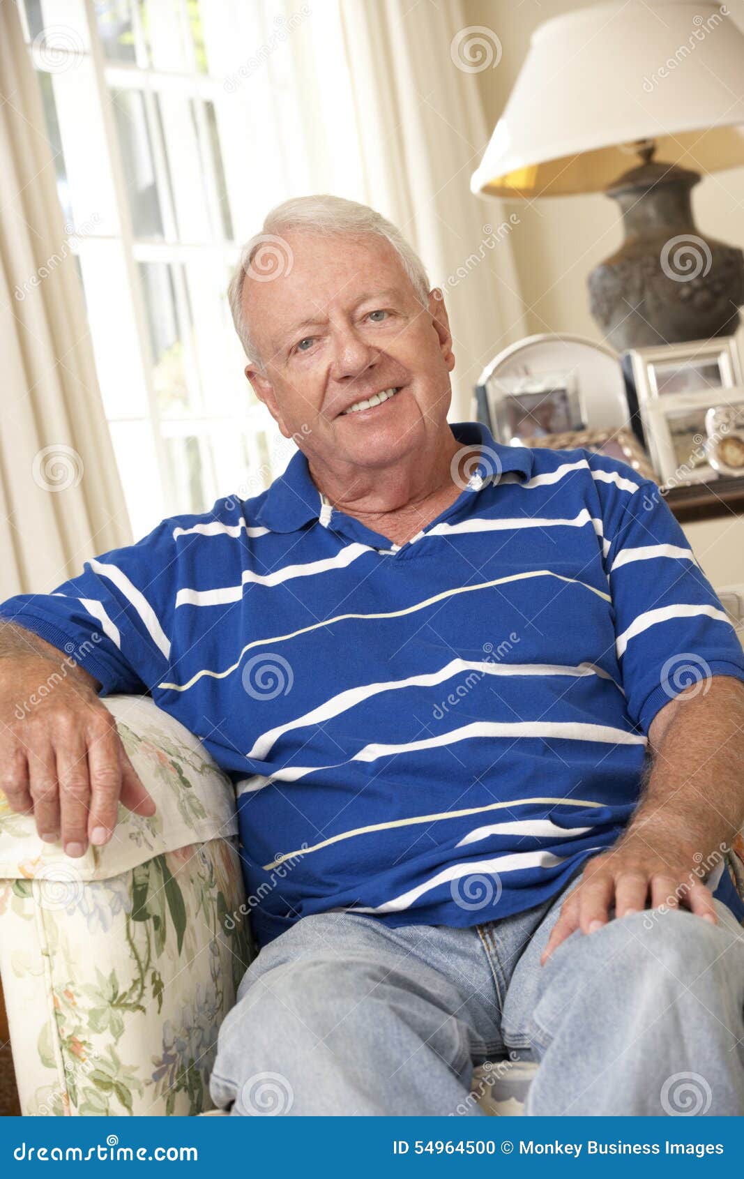 Retired Senior Man Sitting on Sofa at Home Stock Photo - Image of ...