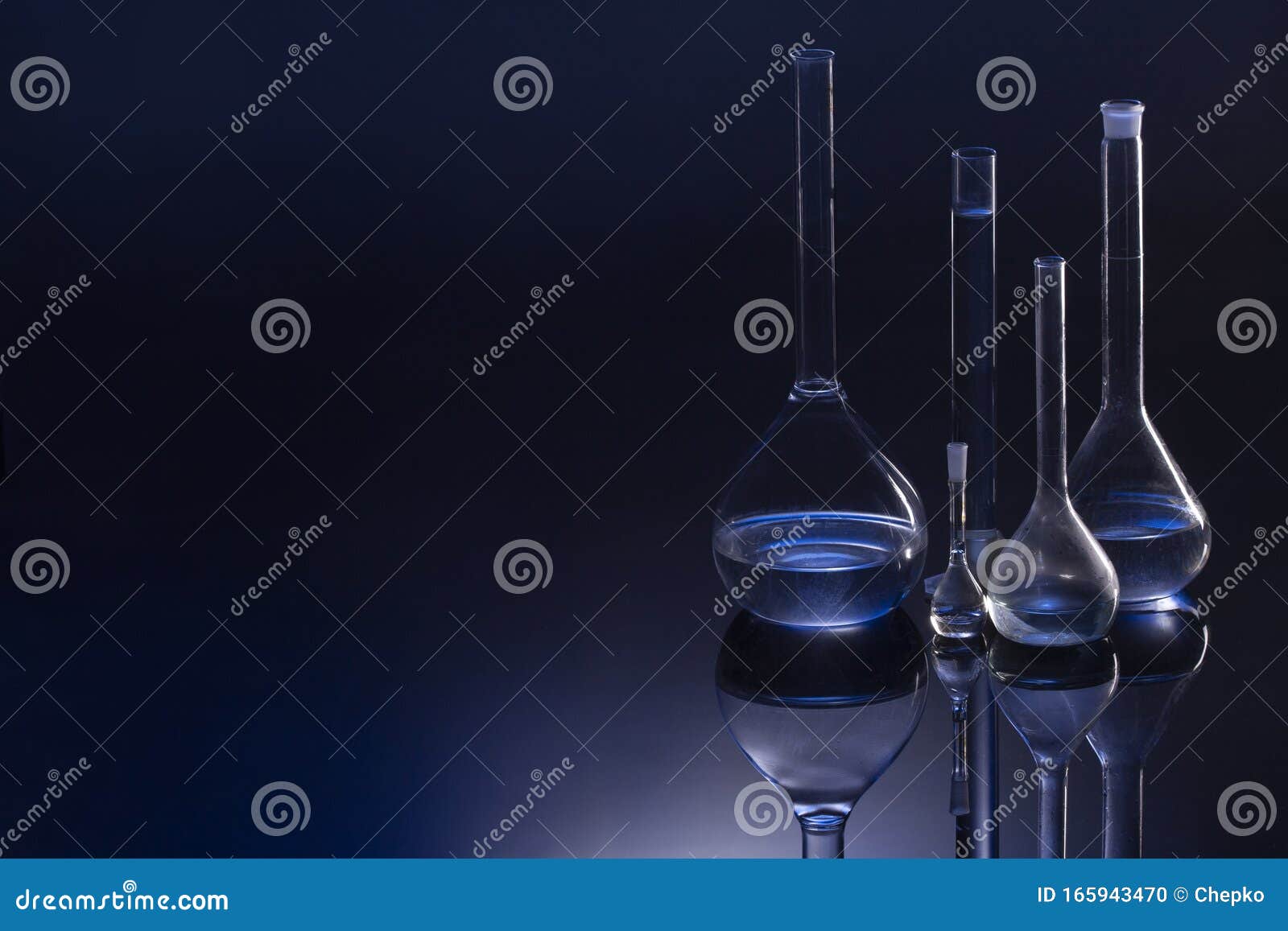 Retort Flask With Blue Liquid On Background. Laboratory Glassware Stock ...