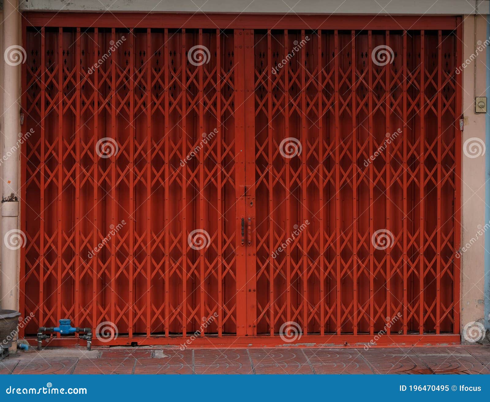 Retractable Folding Metallic Grill in Front of a Shop Stock Image ...