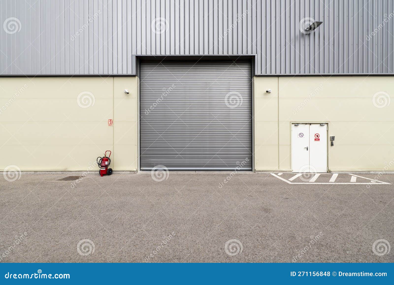 Retractable Metal Gate on the Facade of an Industrial Warehouse with ...