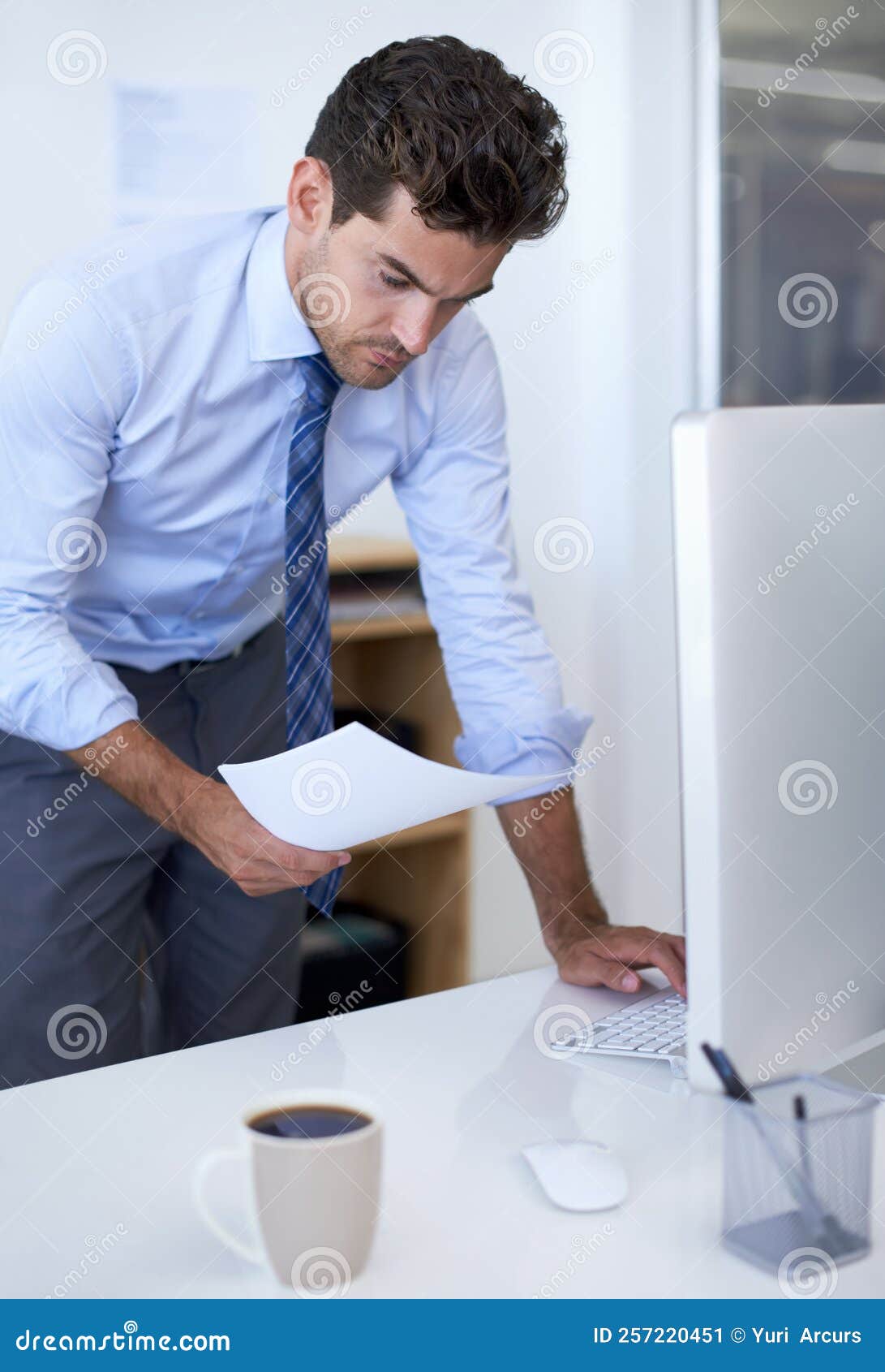 Retrieving Client Information from the Server. a Young Businessman ...