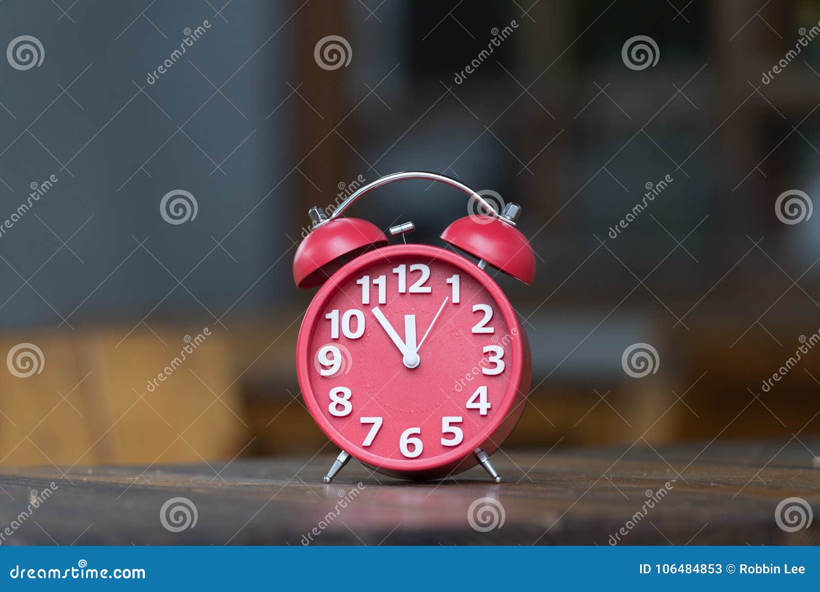Retro Alarm Clock With Five Minutes To Twelve O`clock. Stock Image ... Retro Alarm Clock With Five Minutes To Twelve O`clock. Stock Image ...