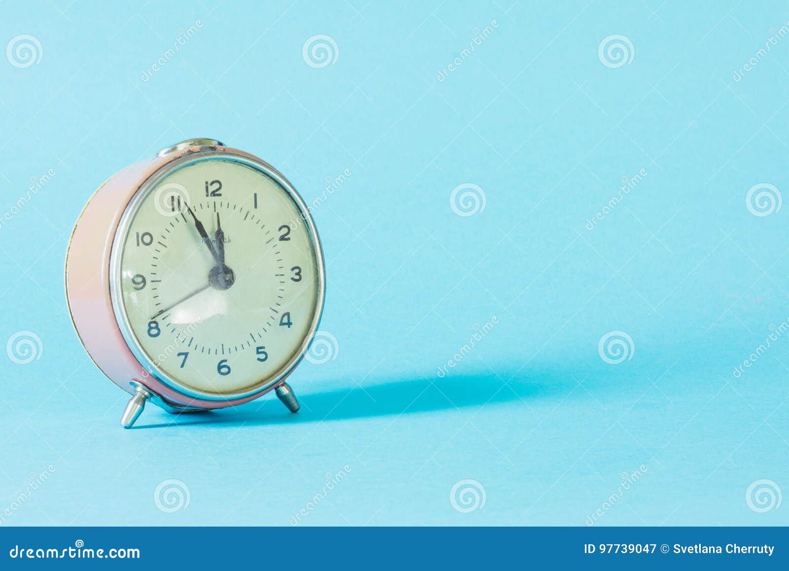 Retro Alarm-clock Time on Blue Pastel Background. Stock Image - Image ...