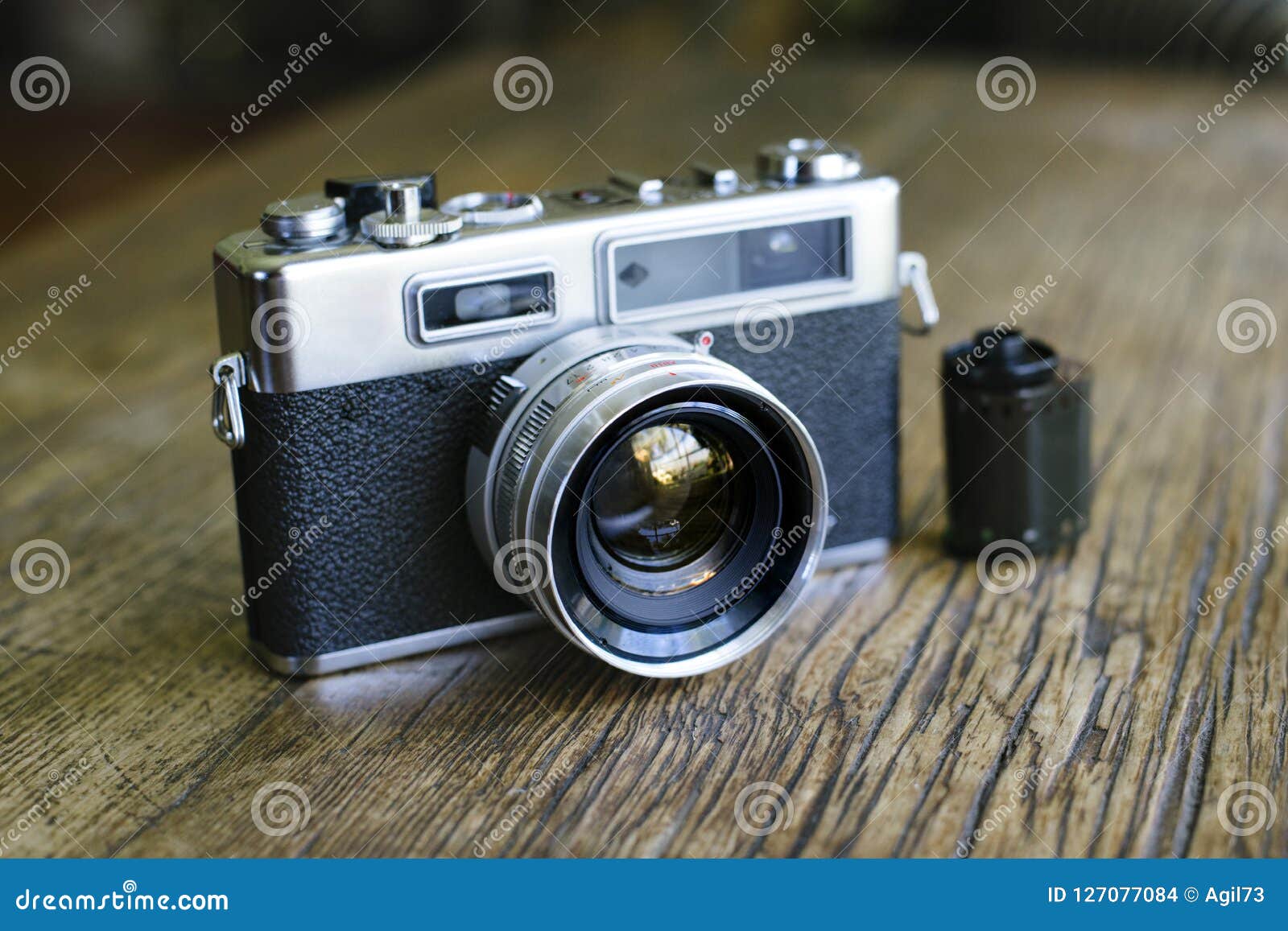 Retro Camera with a Roll of Photographic Film Stock Photo - Image of ...