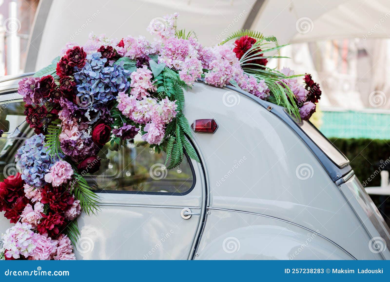 Retro car covered flowers stock image. Image of nature - 257238283